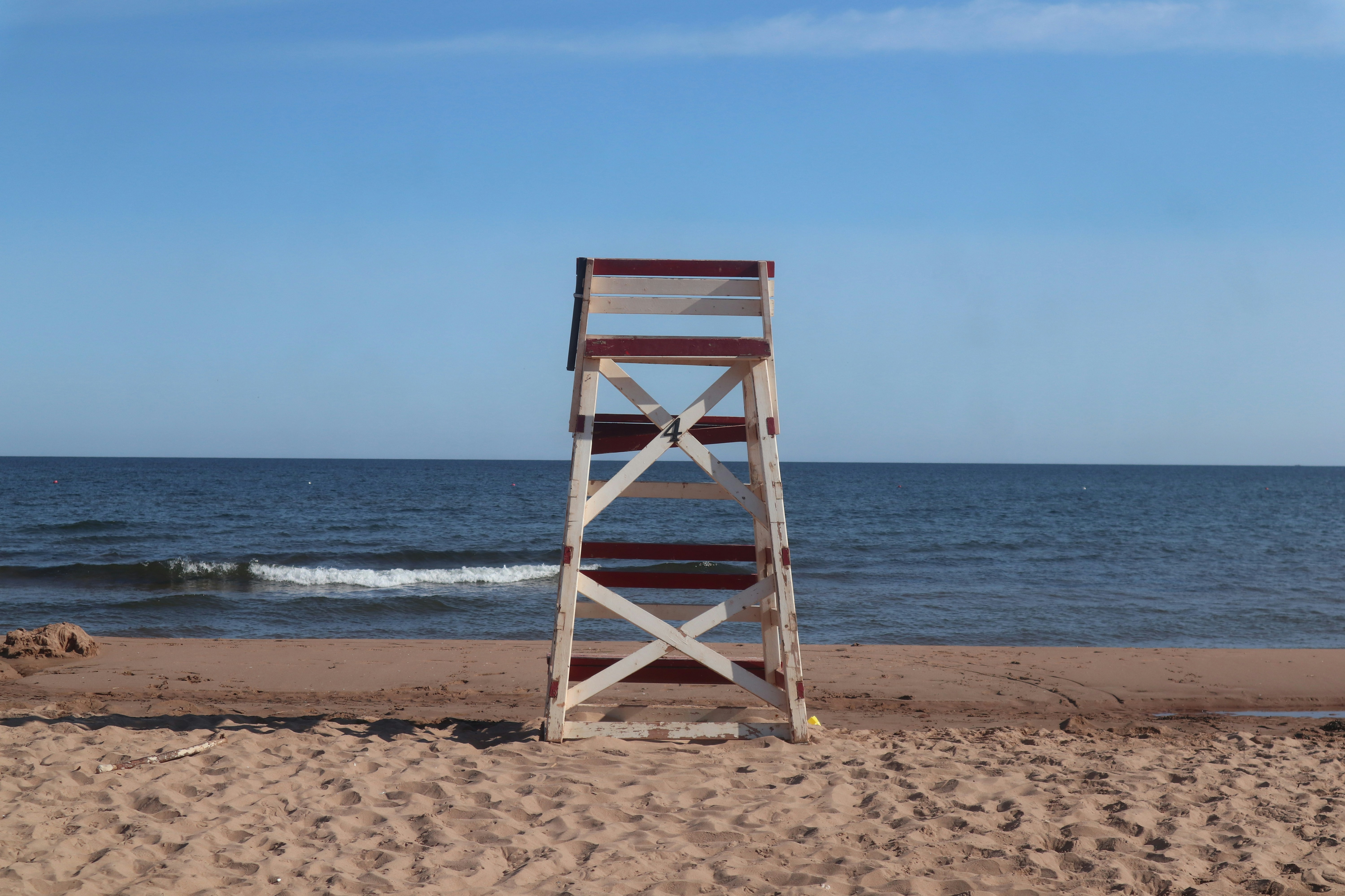 Lifeguard Post Standing Against the Quiet Sea