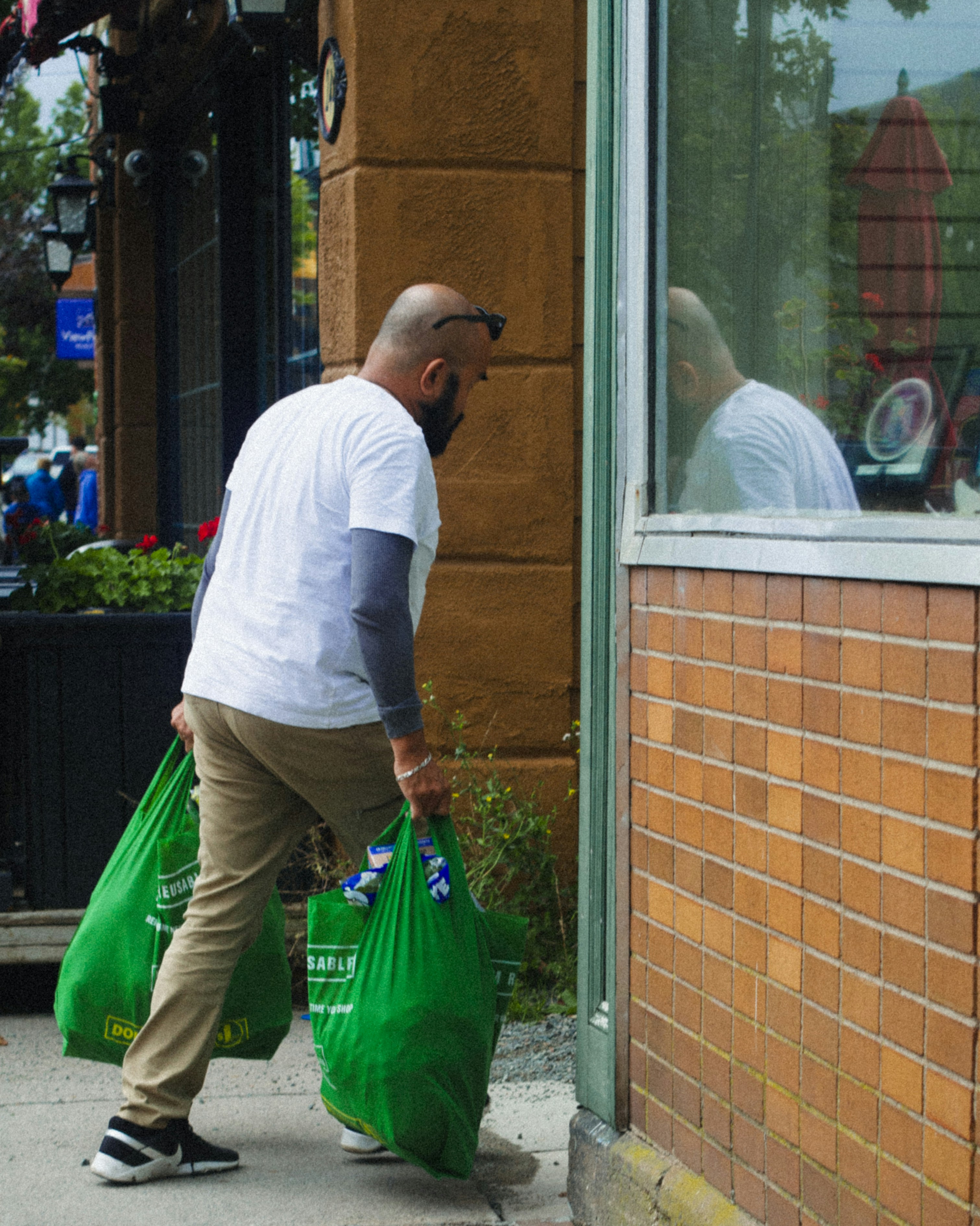 Urban Shopper in Transit: A Casual Glimpse by the Storefront
