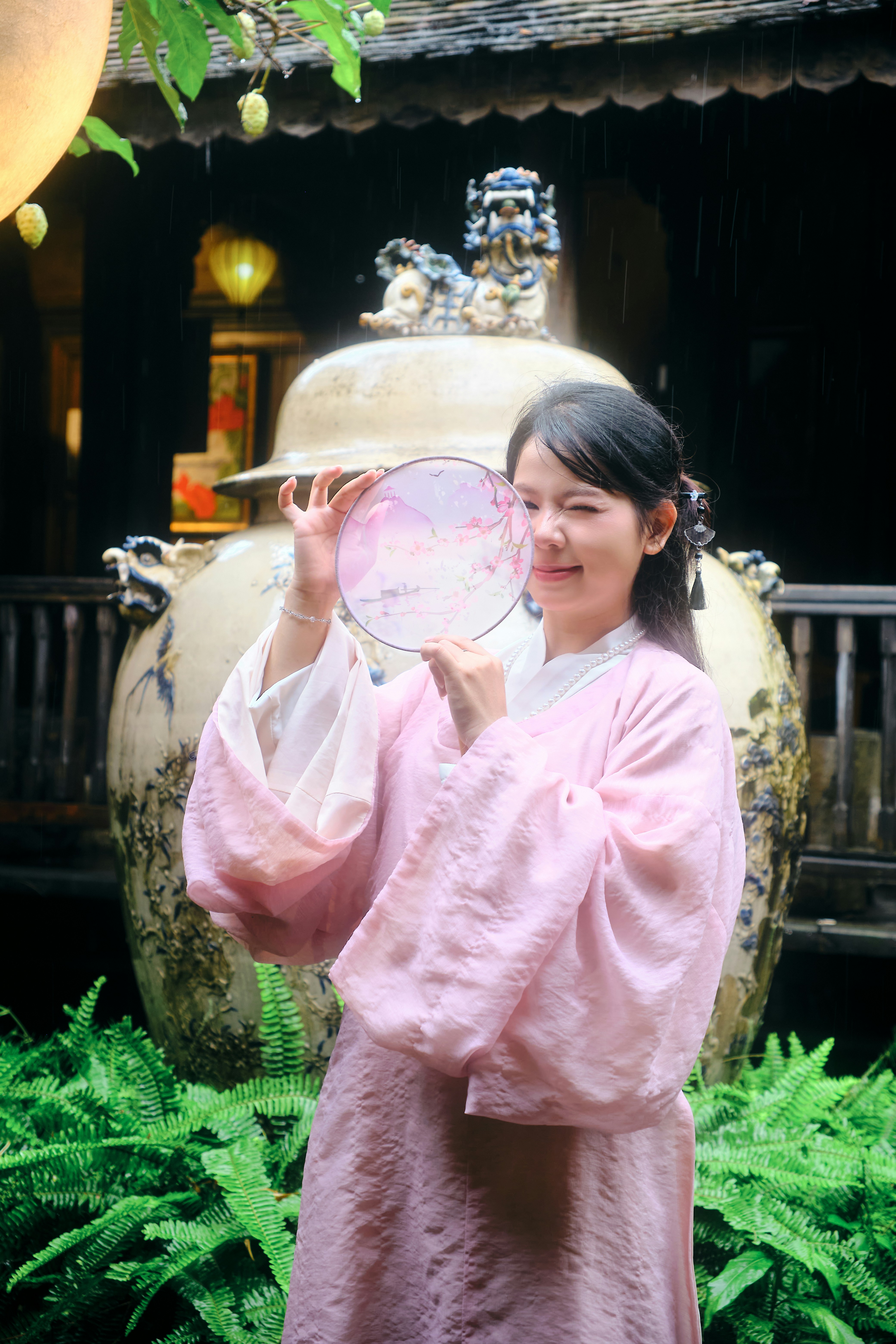 Pink Robe, Soft Focus: A Gentle Moment with the Circular Window