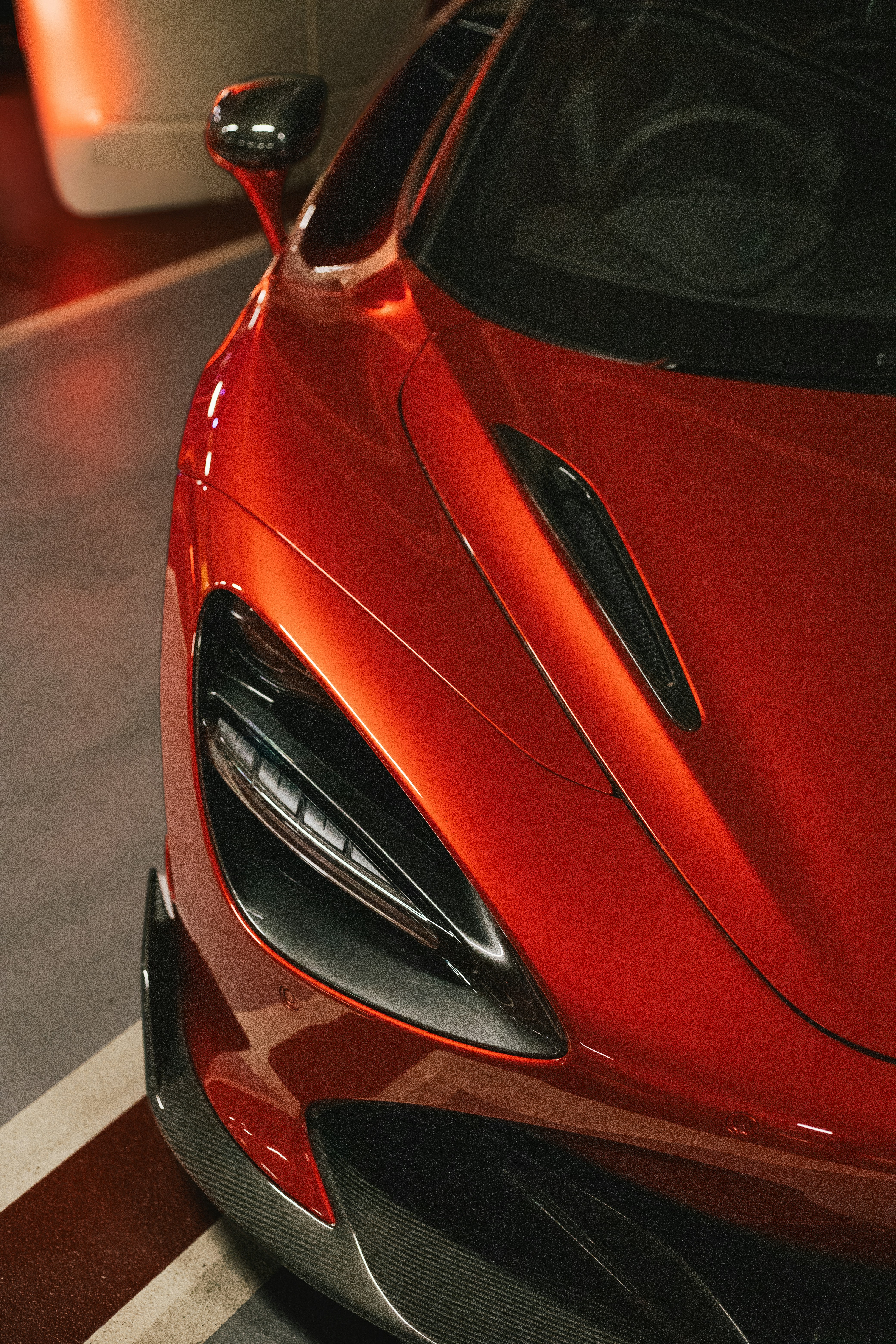 Close-up of a Red Supercar: Precision Curves and Carbon Accents