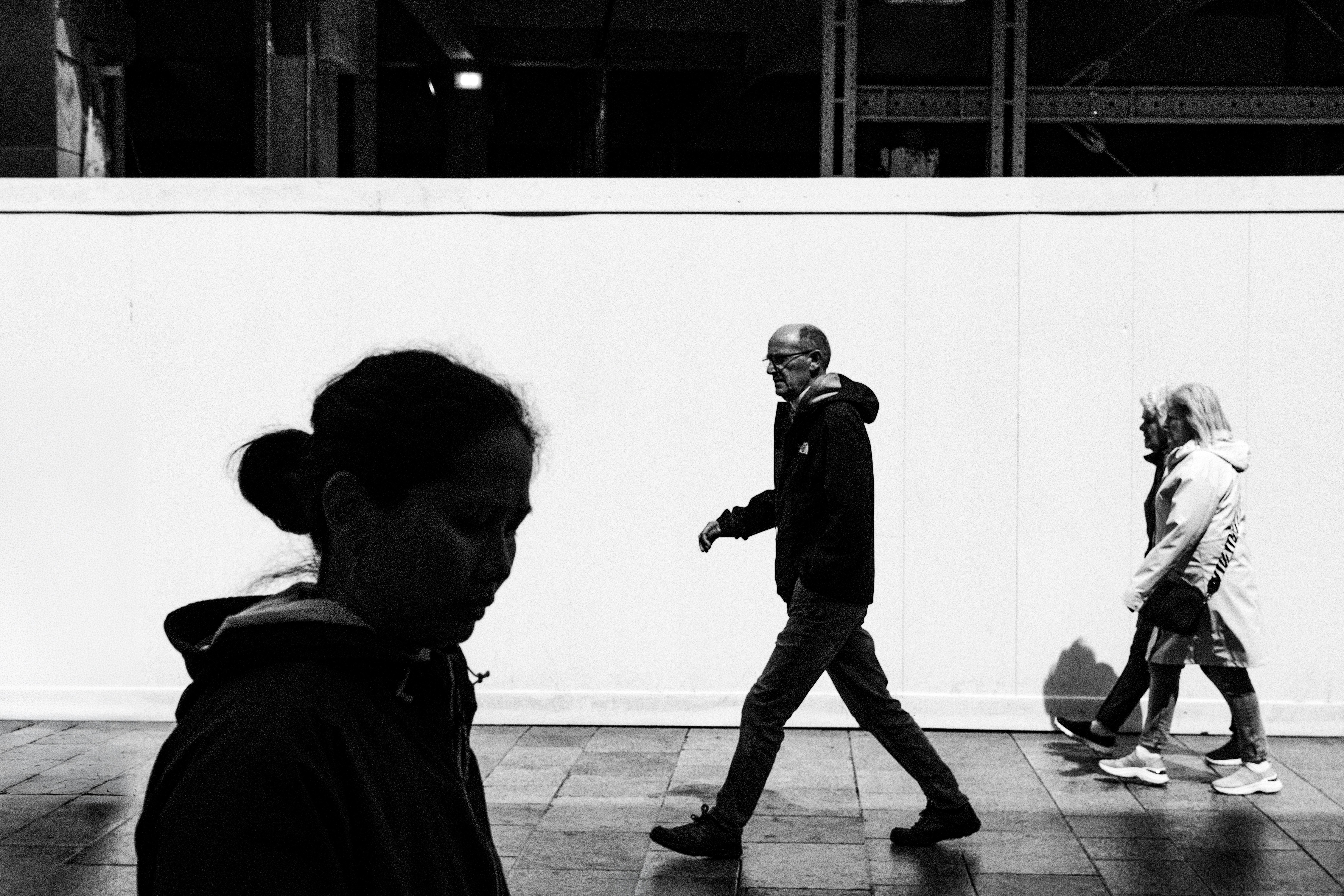 Passing Faces in a Quiet City Corridor