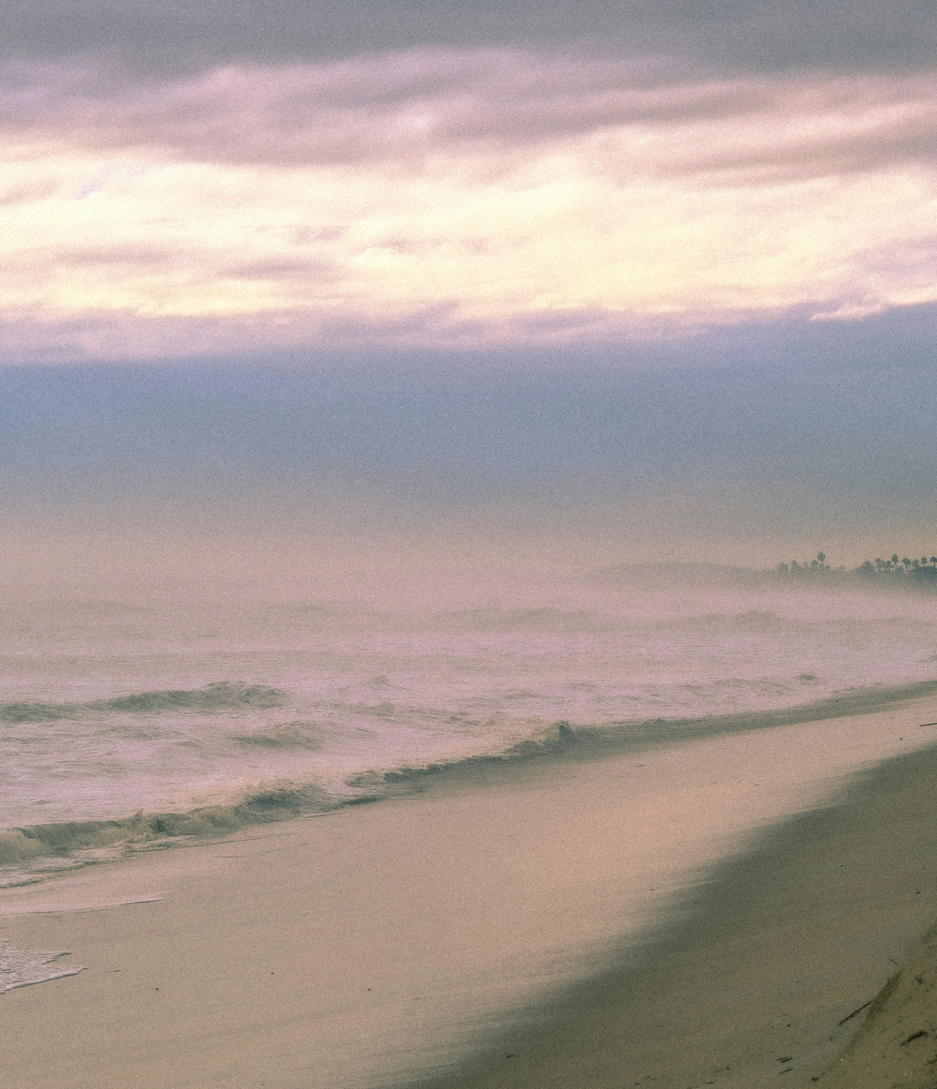Quiet Shoreline Mist: Dawn on the Empty Beach