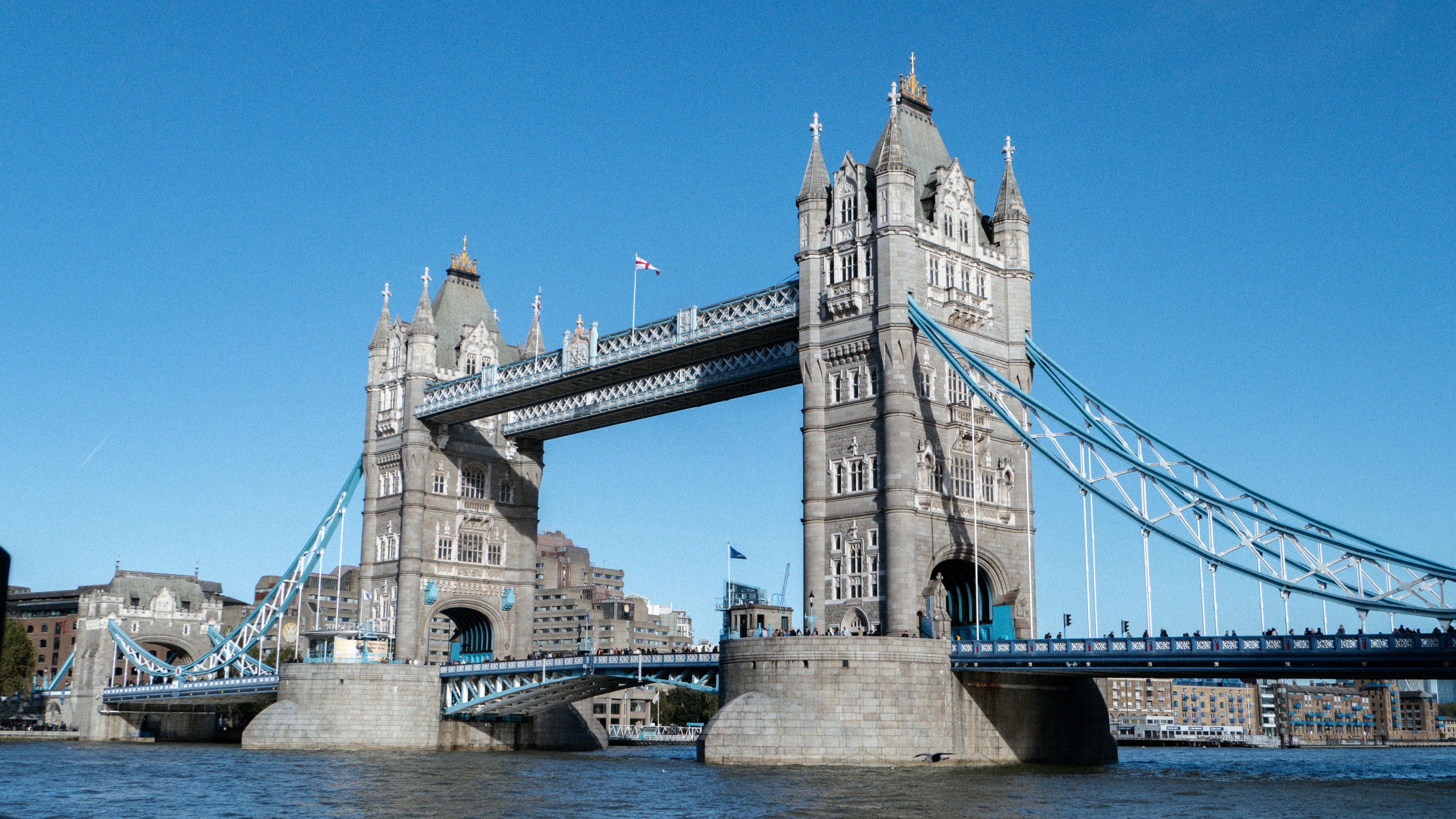 Towering Grace: The Twin Towers of London Span a Bright Blue Sky