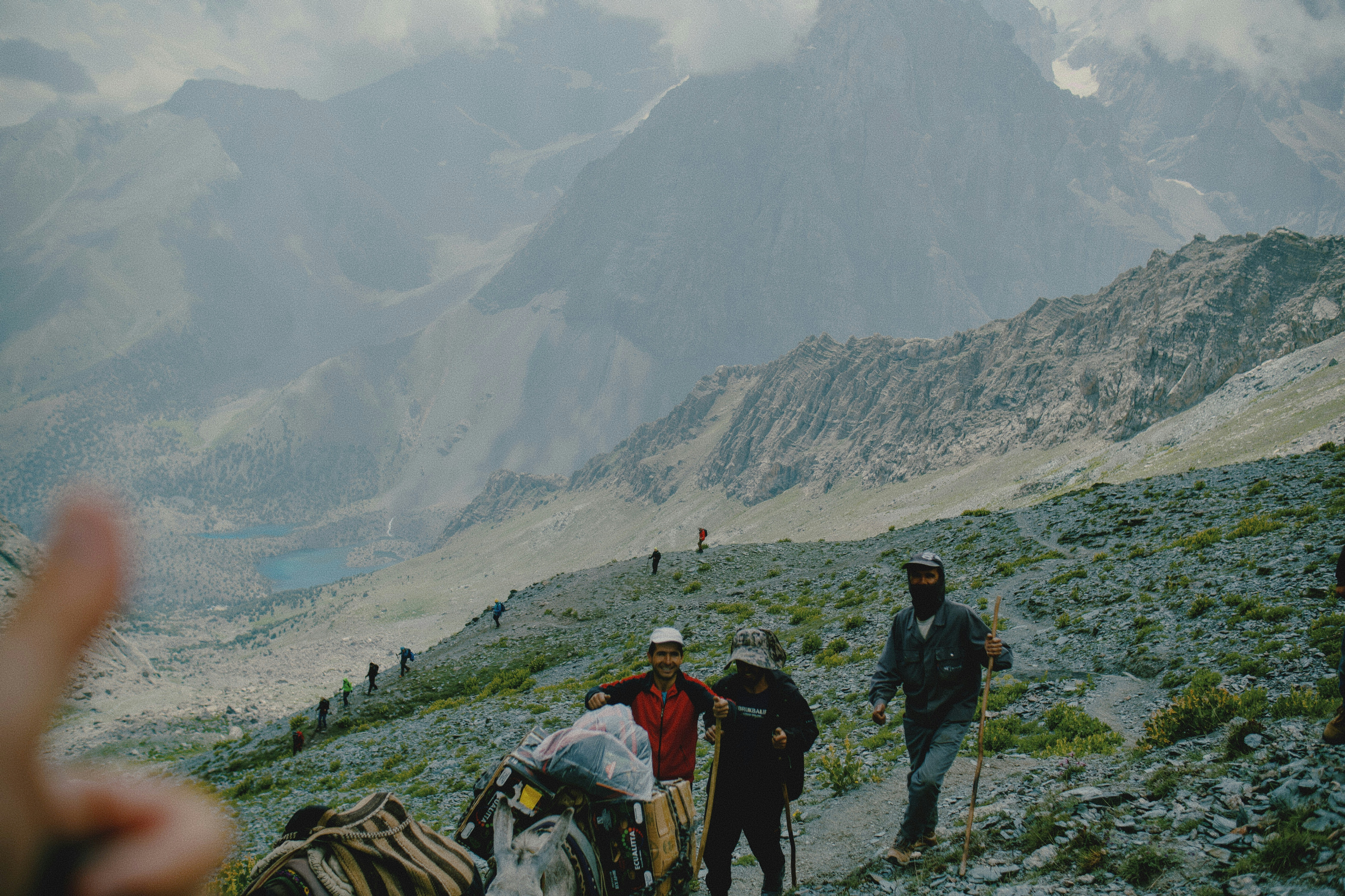 Ridge Crossing: Climber Teams Amid Alpine Tolds and Mist