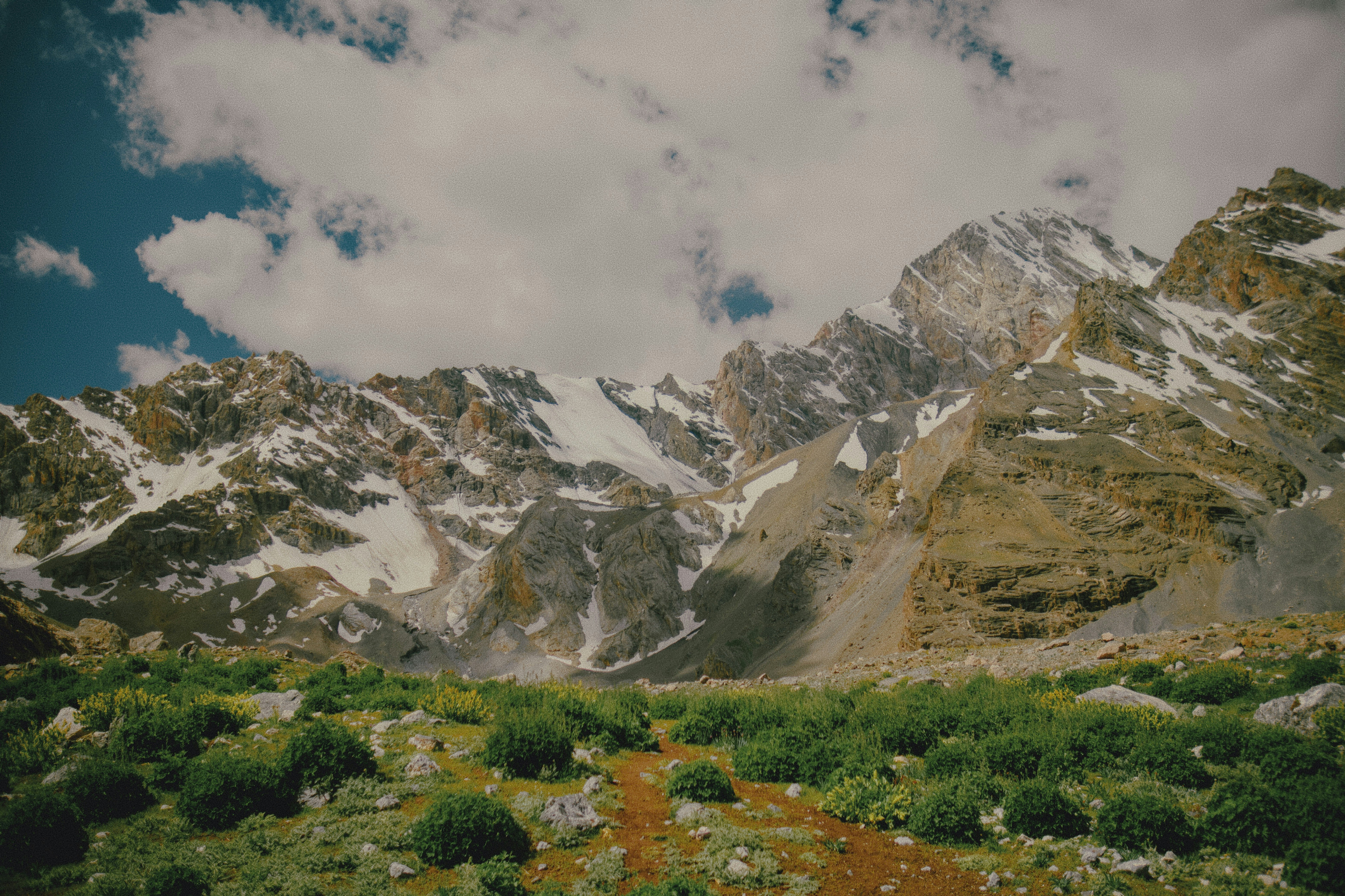 Snow-kissed Peaks over Verdant Foothills