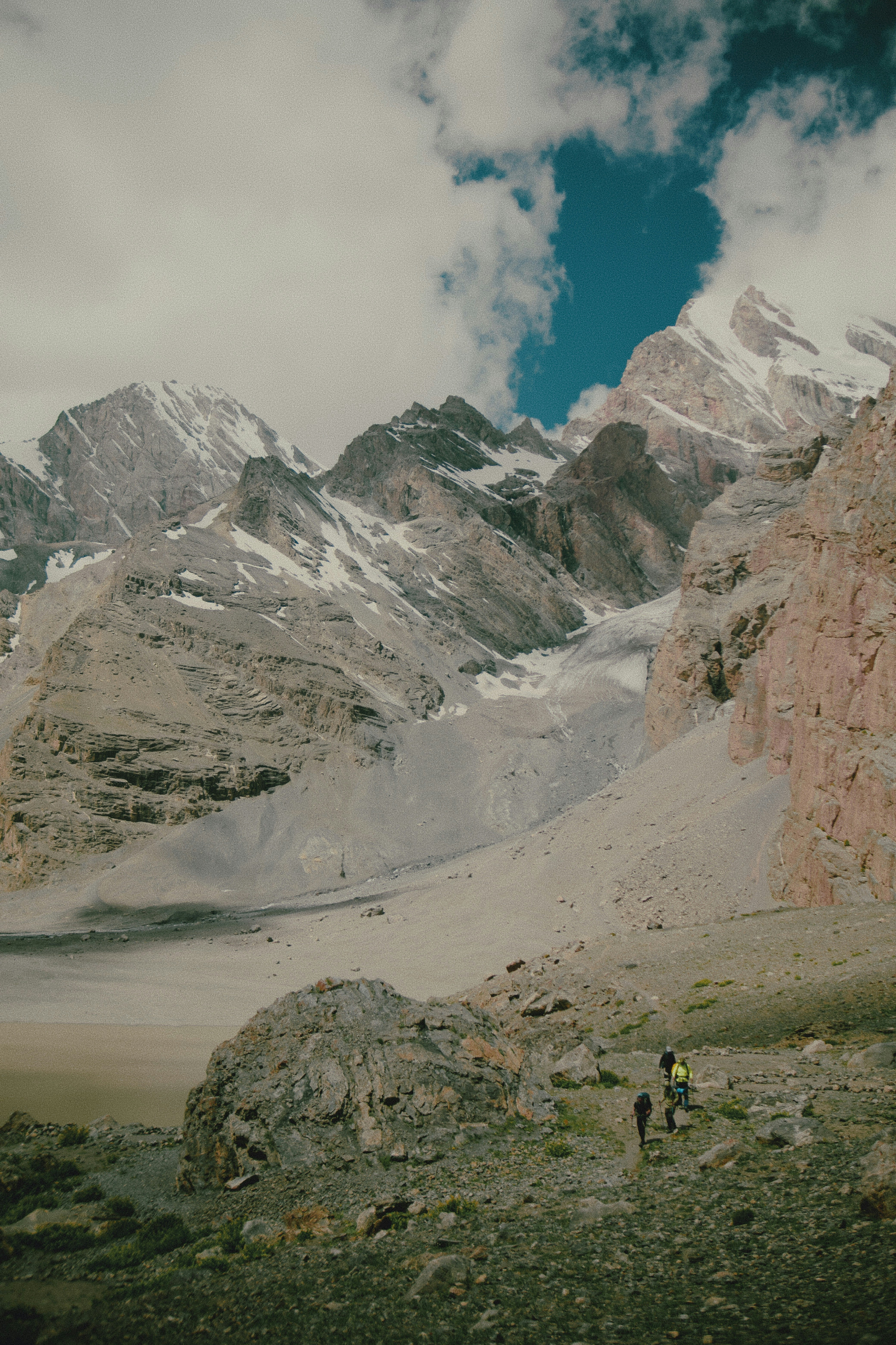 Trail to the Seracs: Climbers at the Base of a Snowy Peak