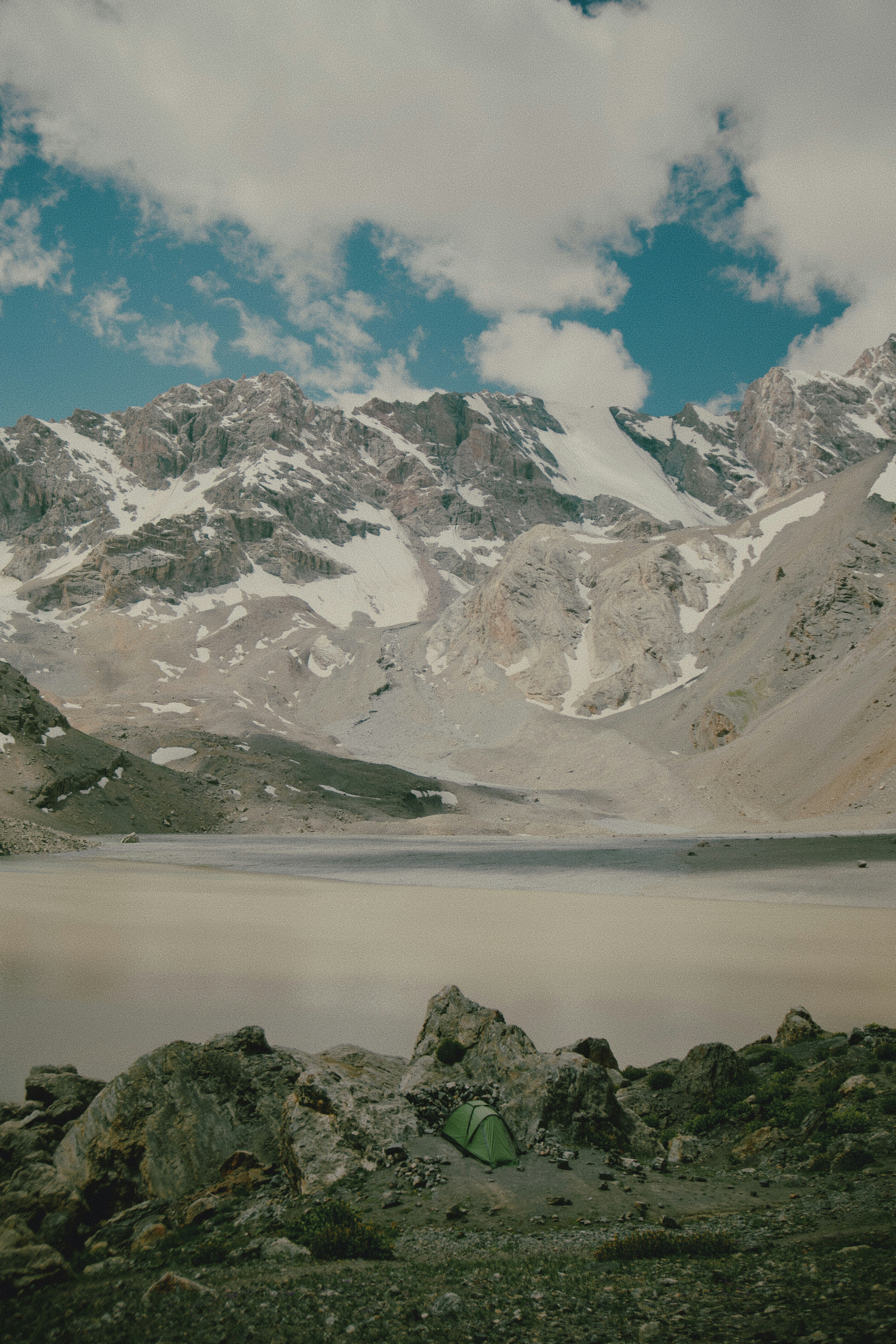Green Tent Among Alpine Giants