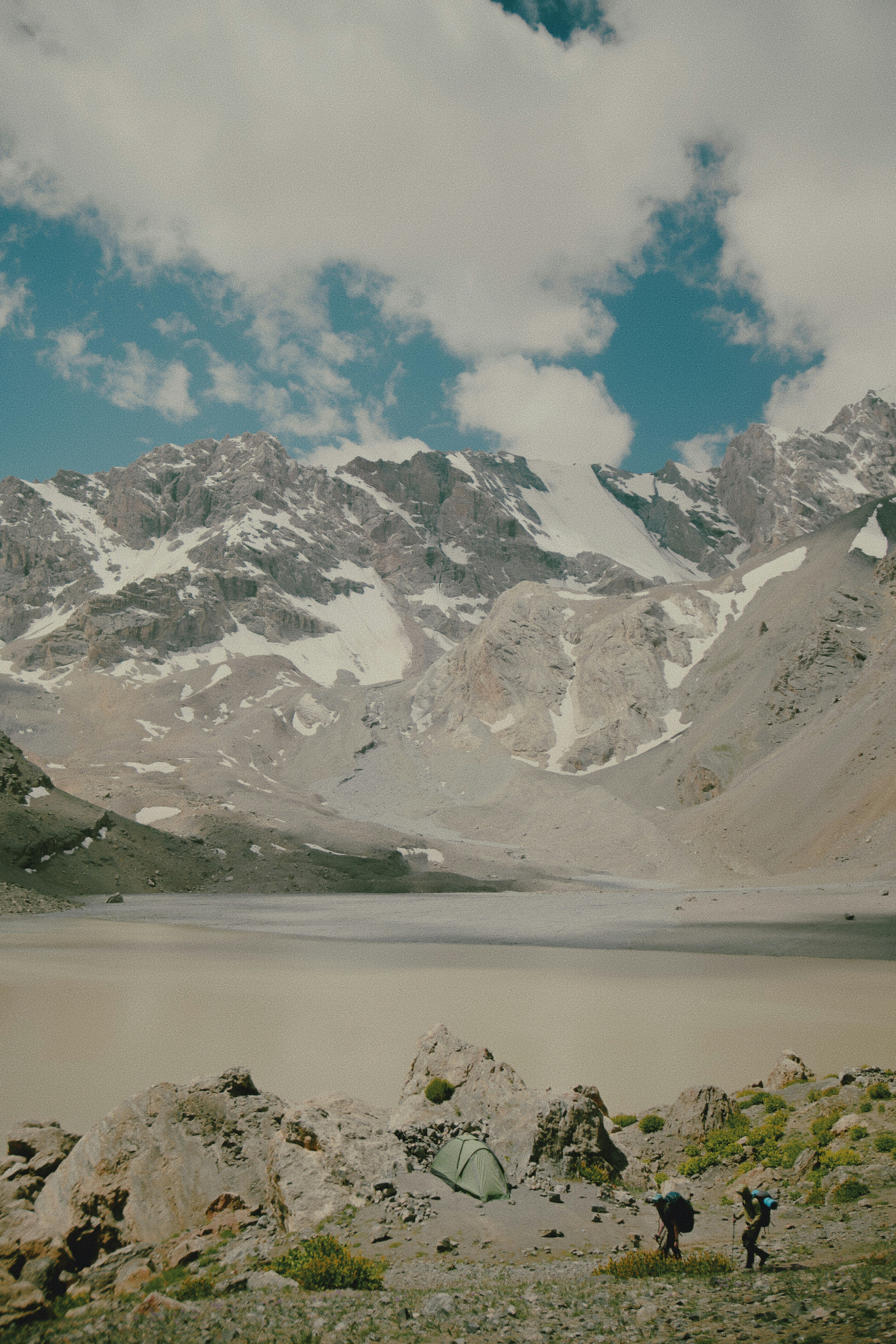 Highland Ledger: Tents at the Edge of a Glacial Basin