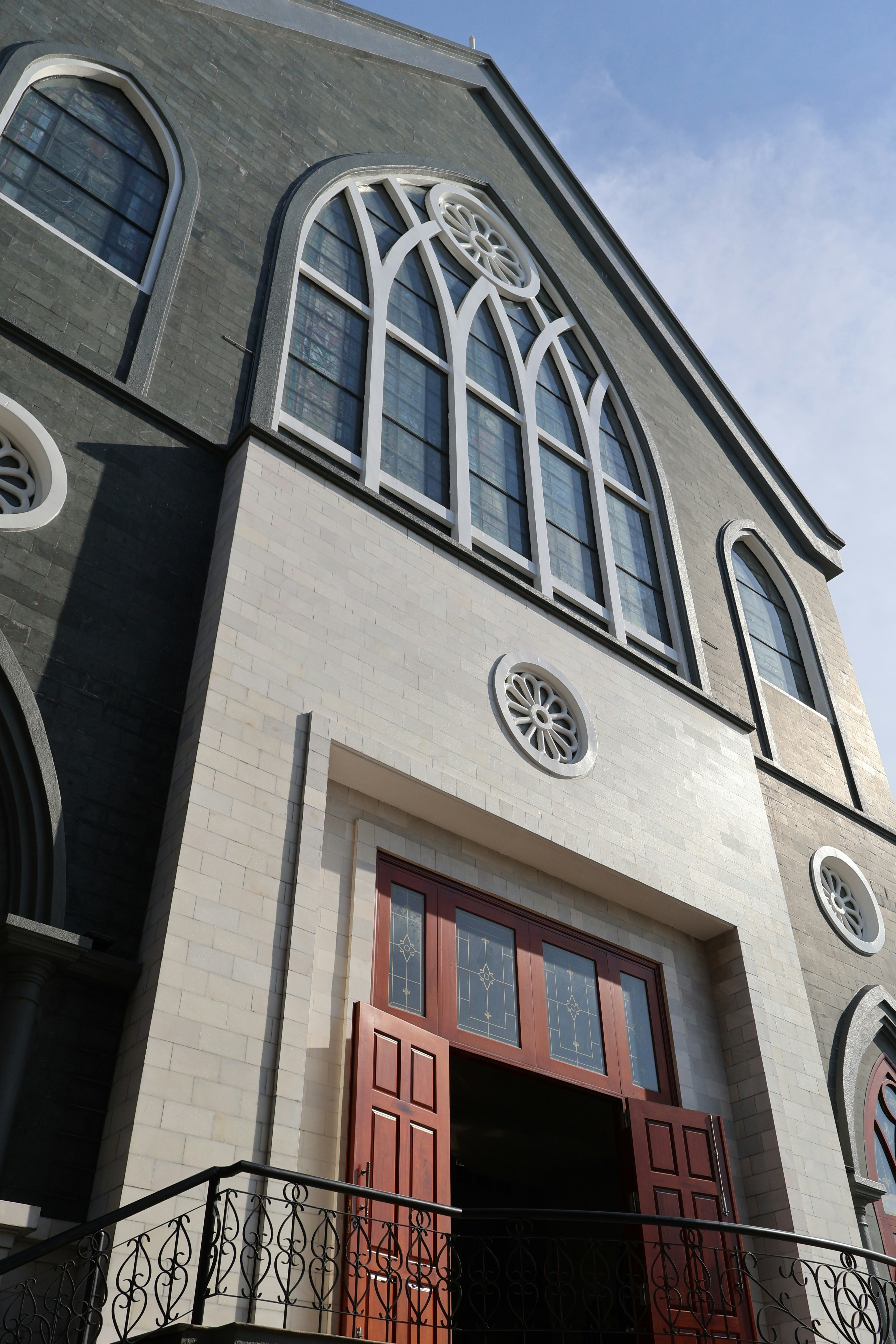 Gothic Facade: Open Doors to a Stately Church