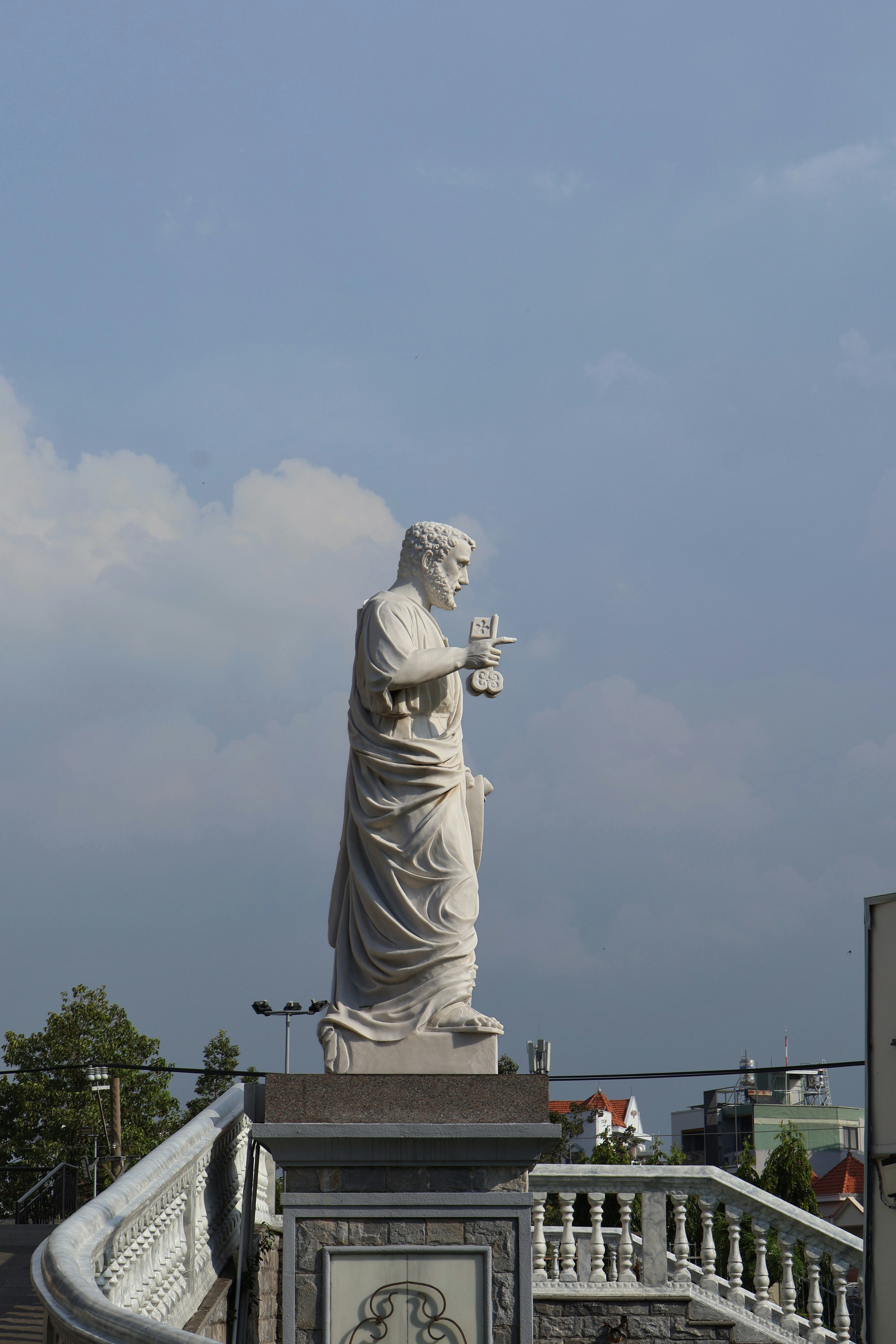 Statue of Wisdom Under a Wide Sky
