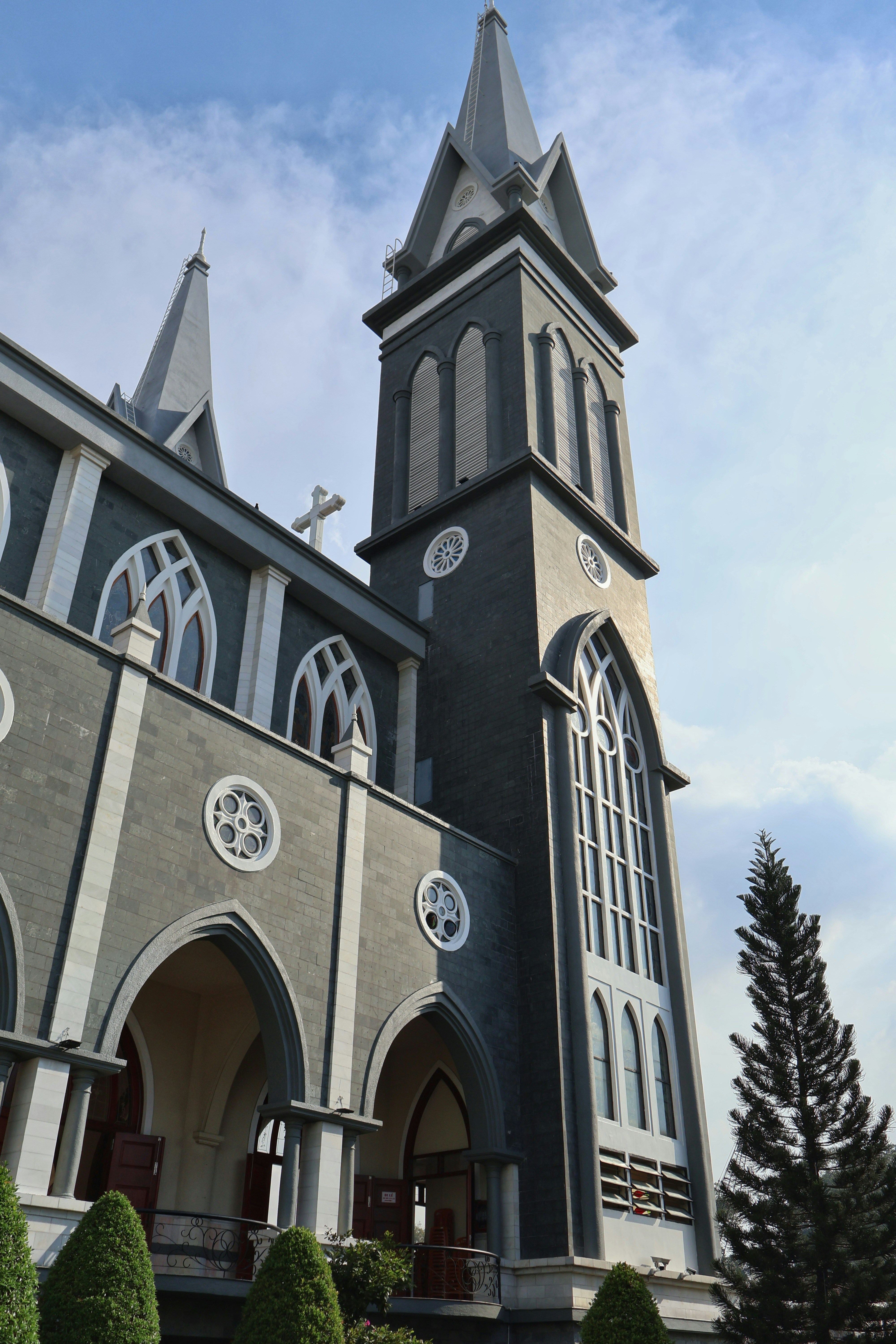 Gothic Facade Rising: A Church Tower Against a Clear Sky