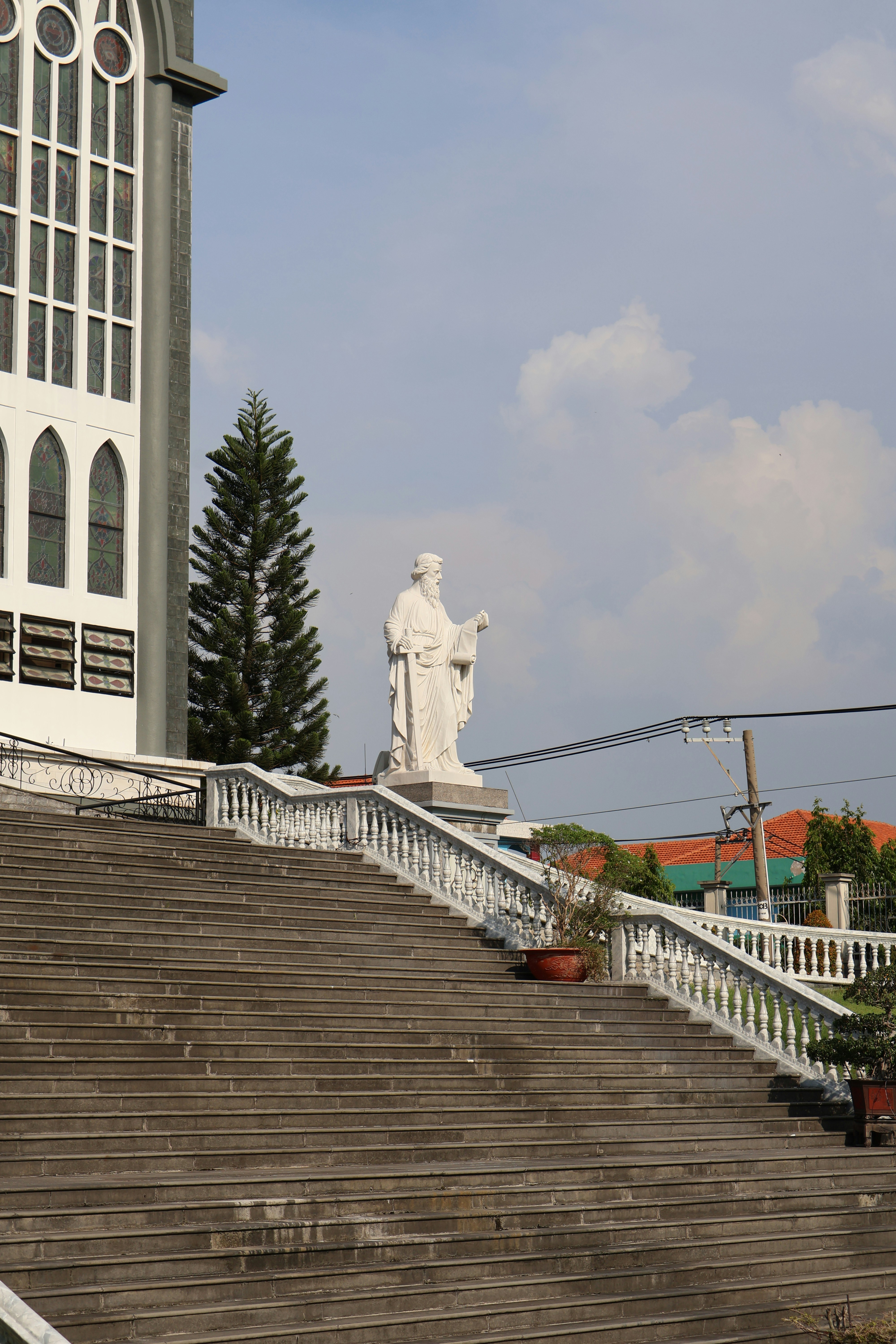 Staircase to Serenity: A statue watches from the terrace above the steps