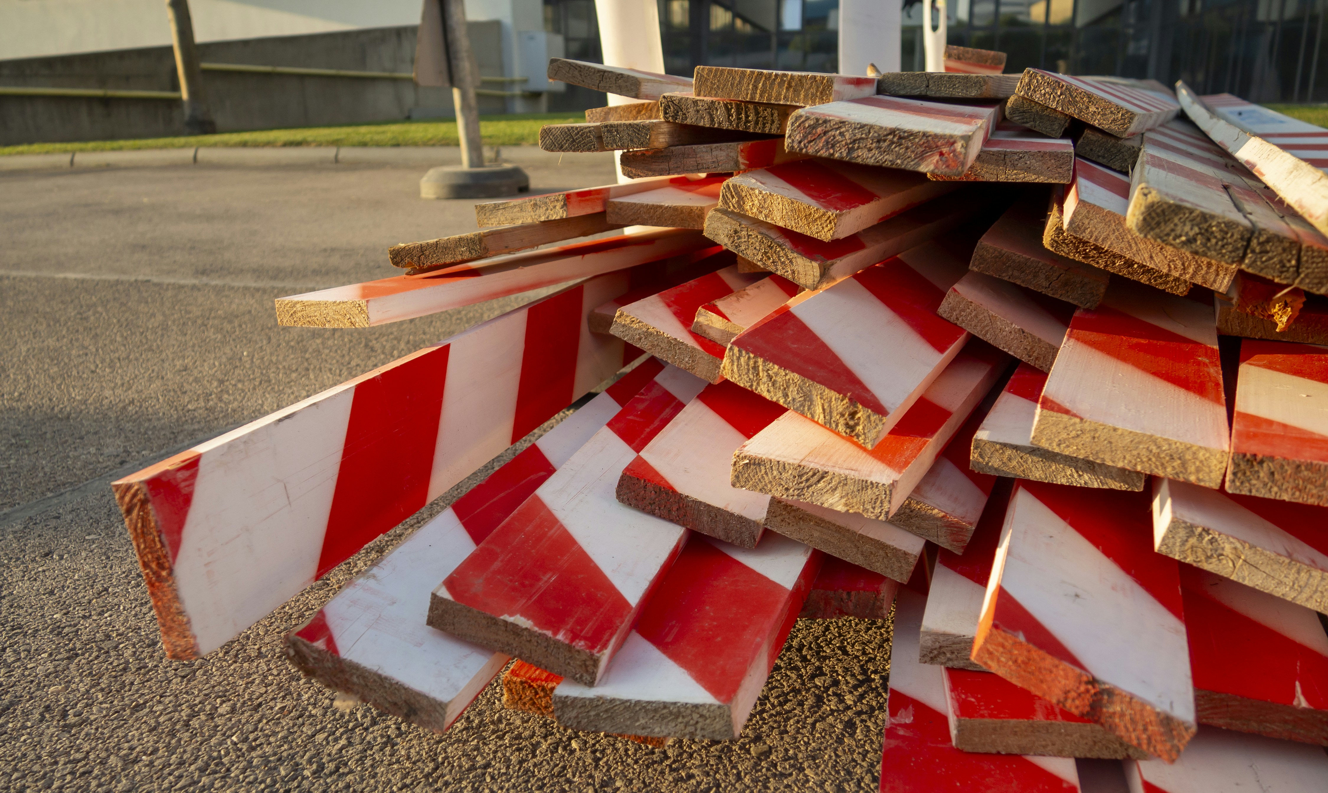 Piled Timber Strips Under Warm Streetlight