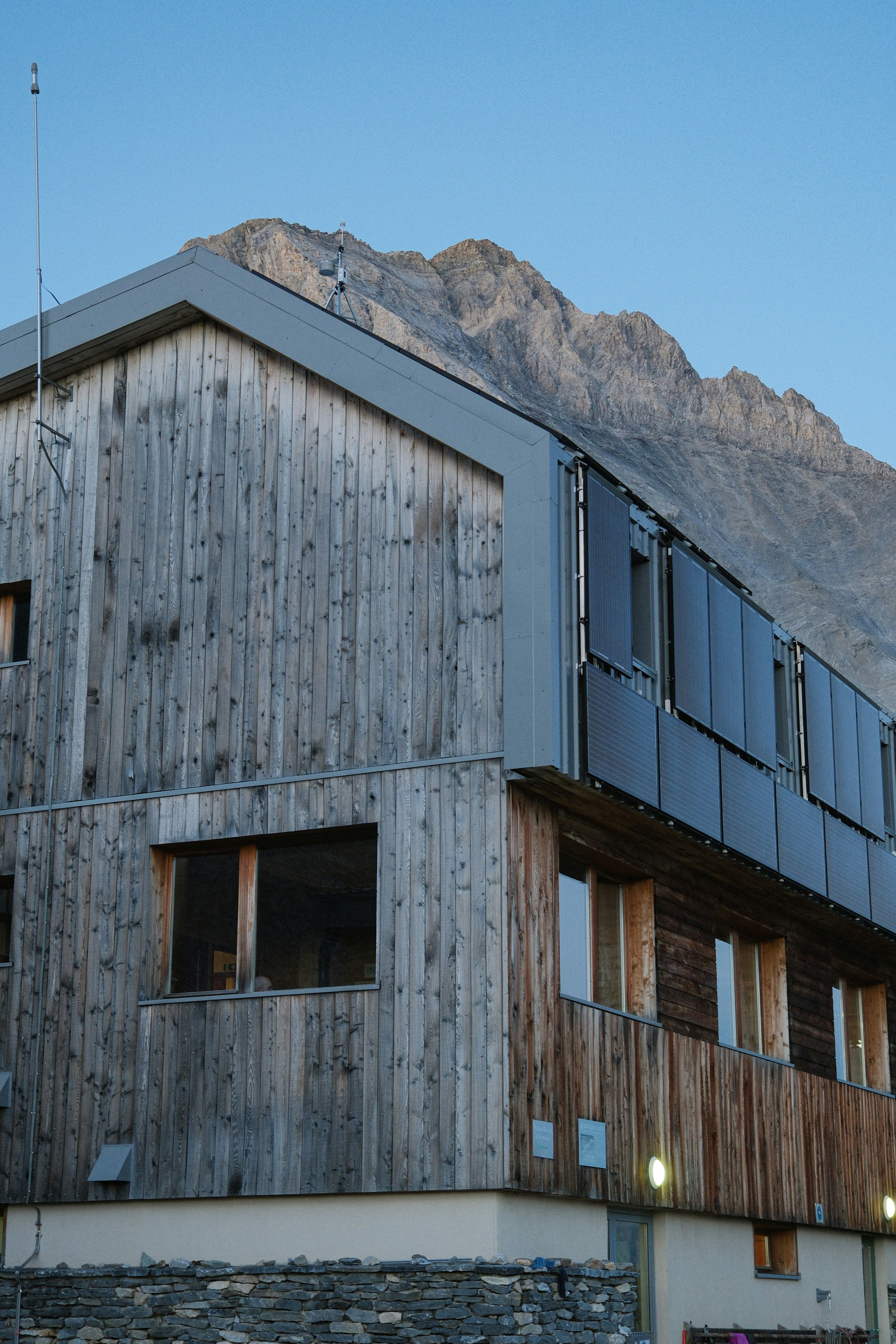 Mountain Lodge at Dusk: Weathered Wood and Alpine Ridge