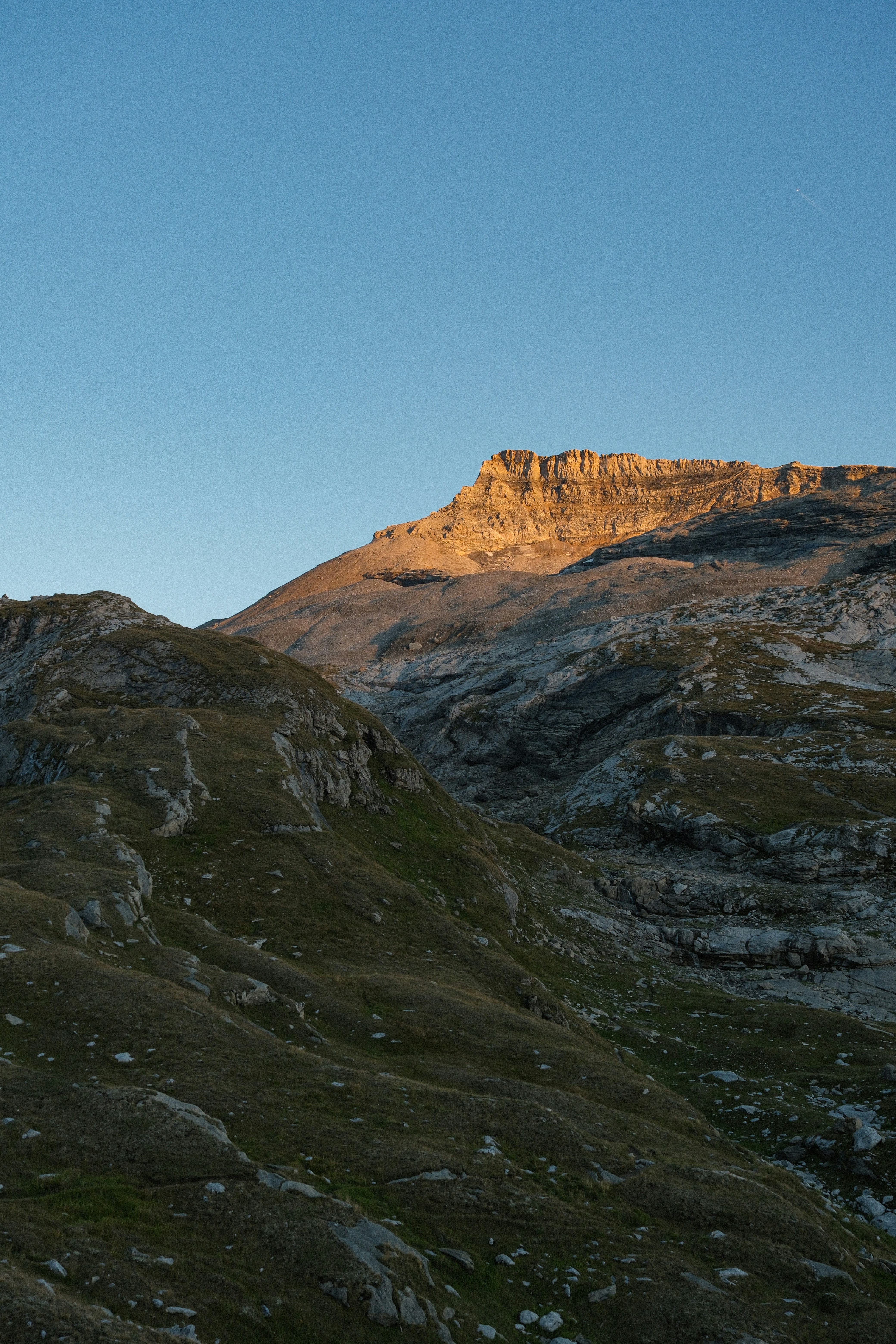 Sunlit Crest: A Quiet Ridge Under a Clear Sky