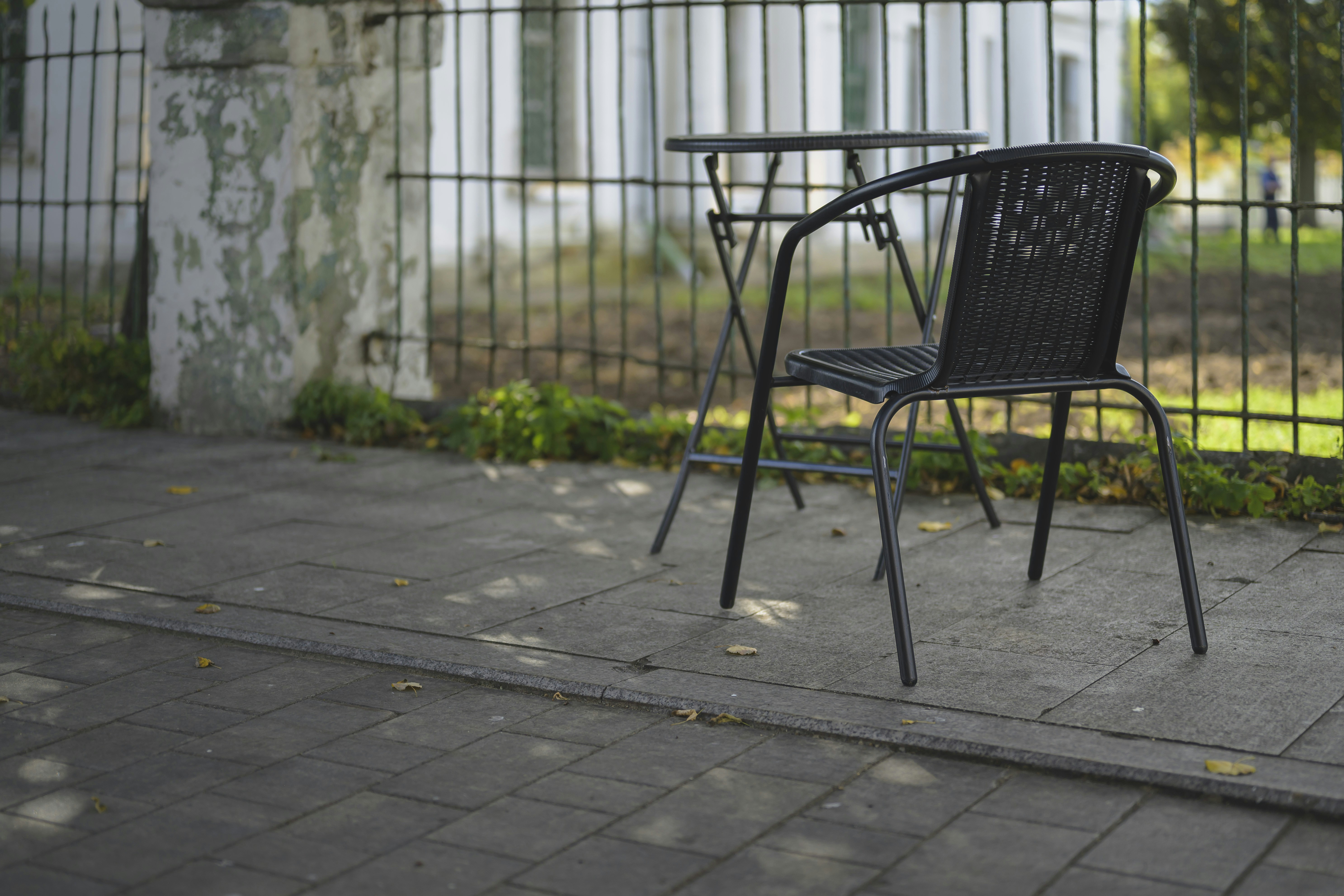 Lonely Chair by the Fence: Quiet Urban Afternoon