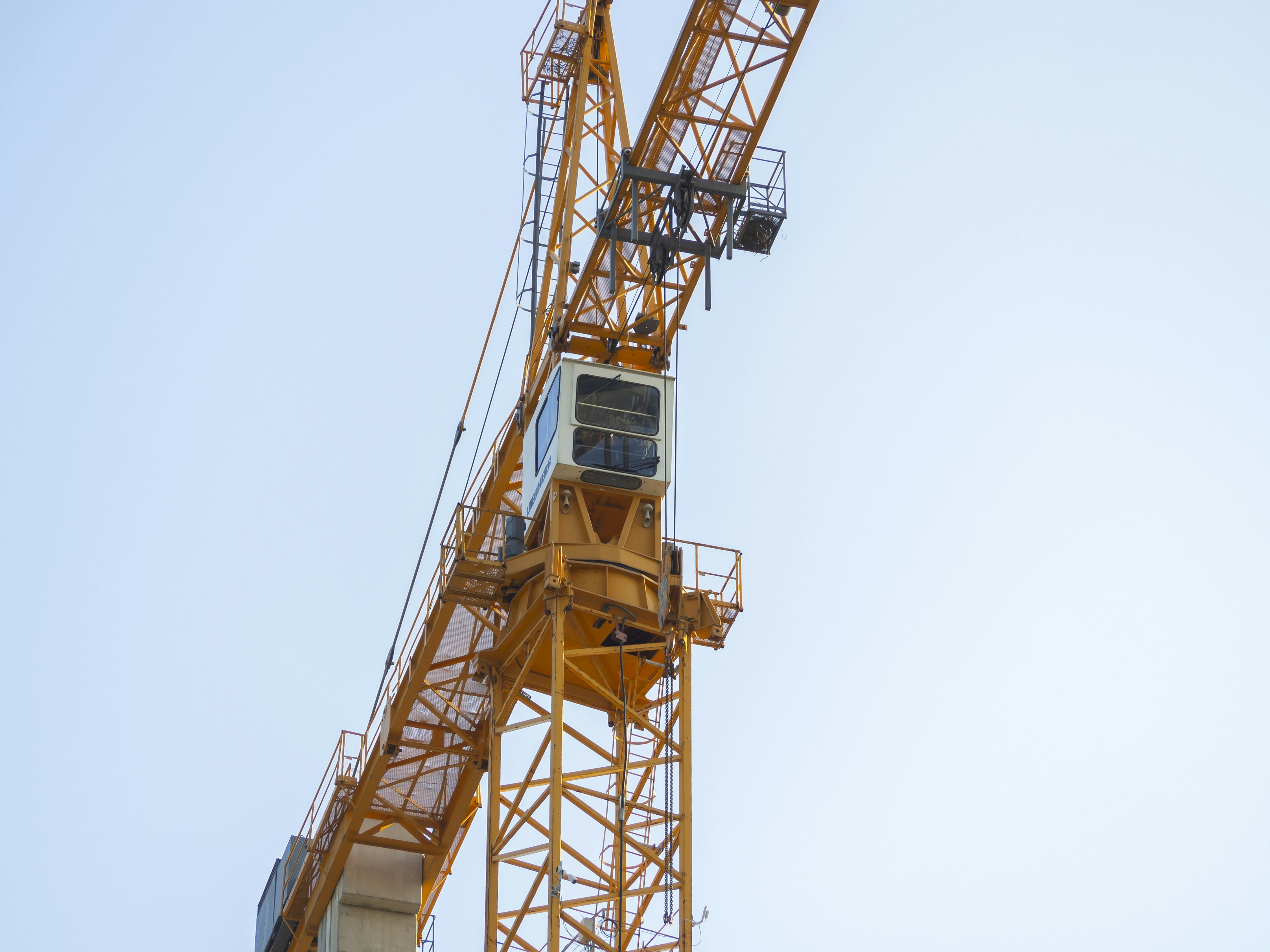 Crane Boom Reaching Skyward: Industrial Geometry and Light