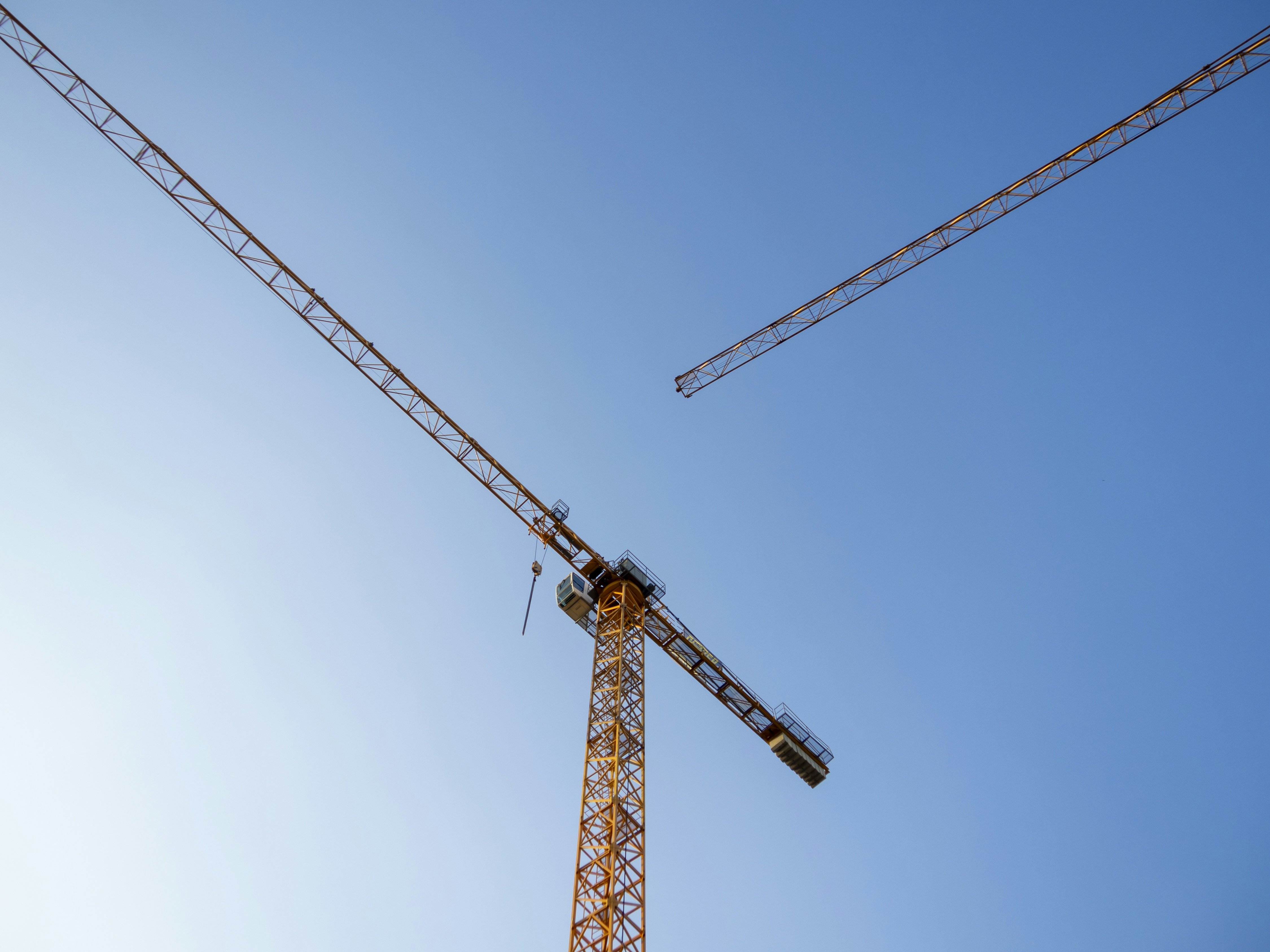 Crane Crossroads at Dusk: A Skybound Geometry