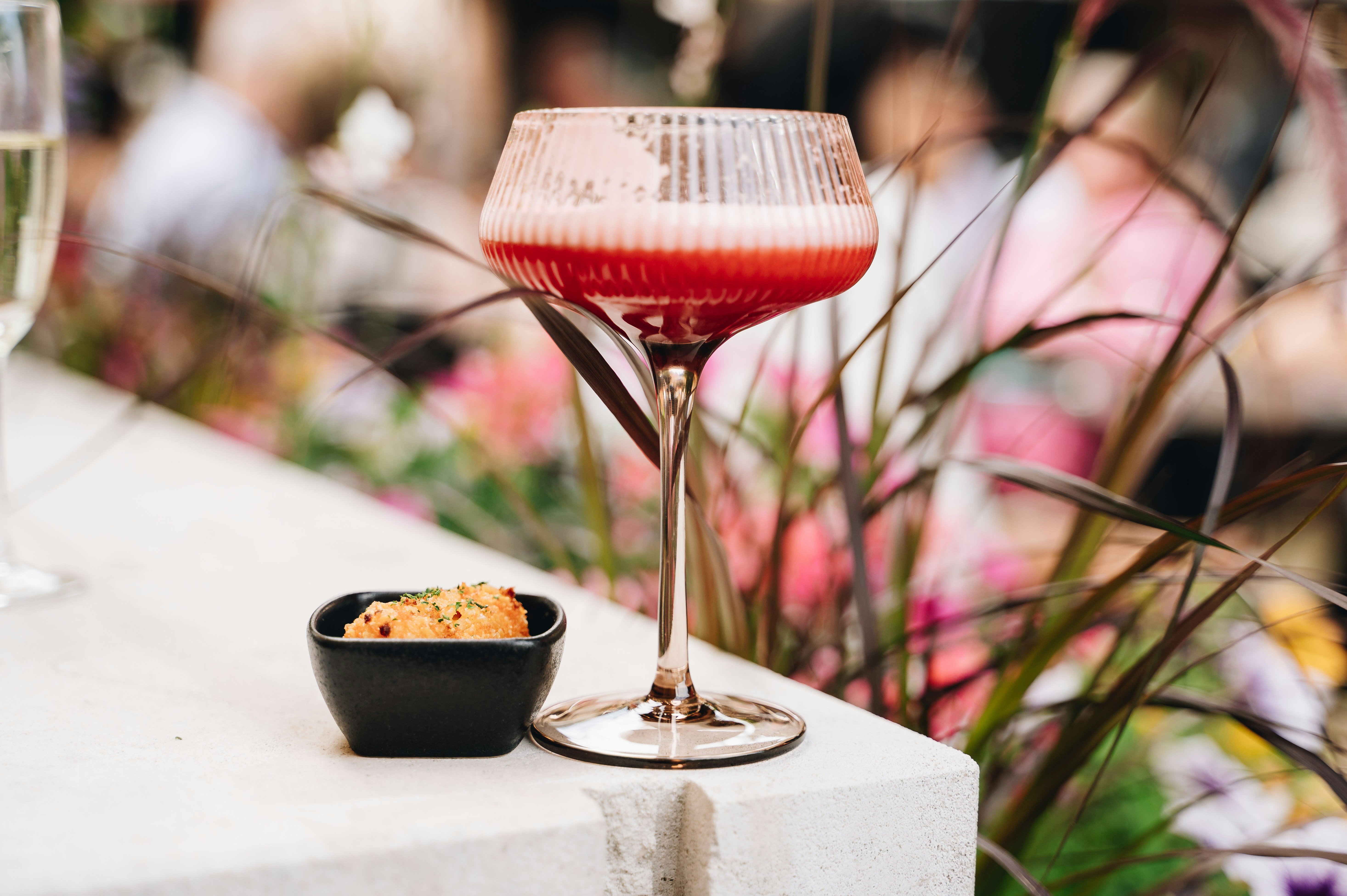 Crimson Cocktail on a City Terrace