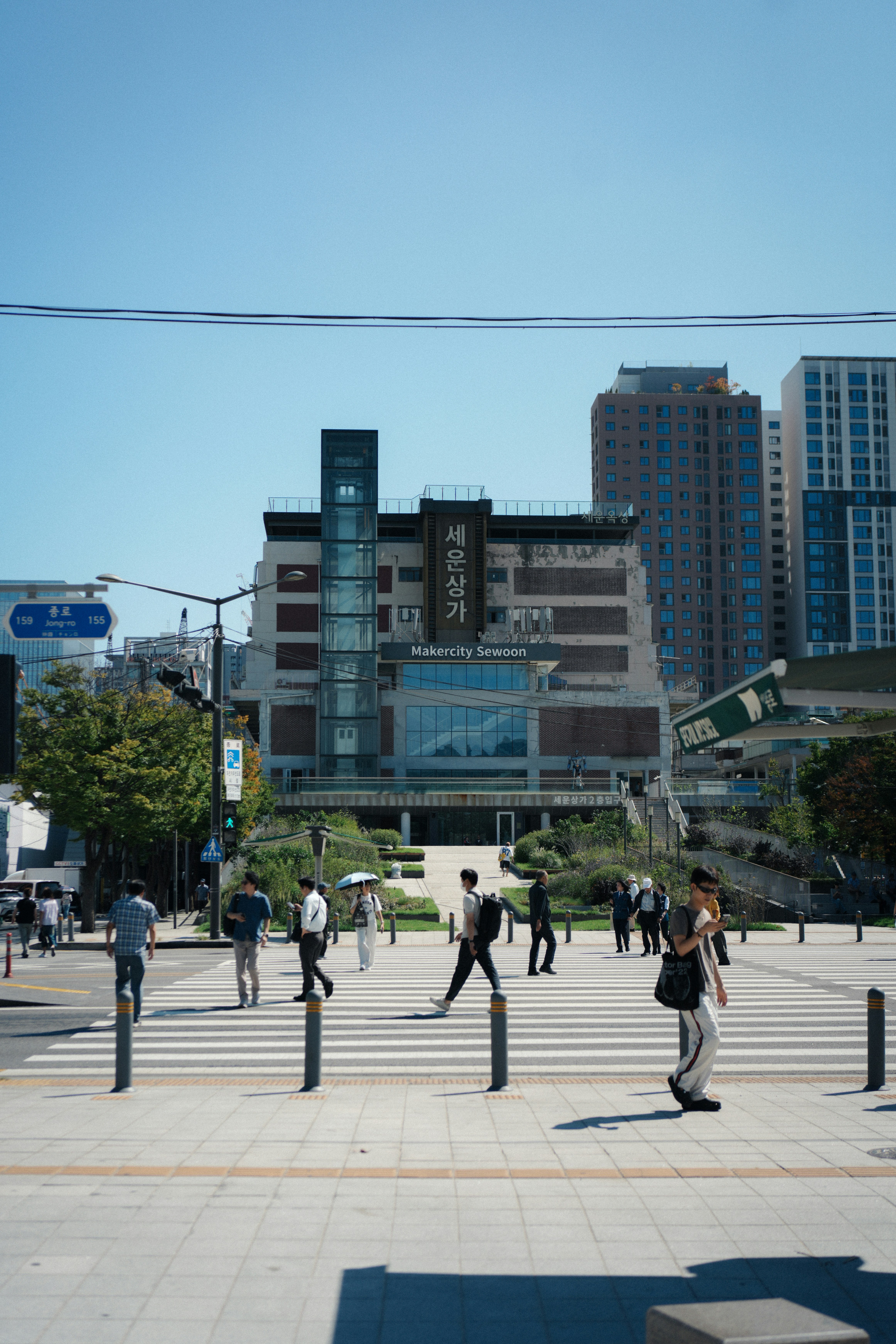 Urban Crossing: Pedestrians Converge at a Modern Transit Hub