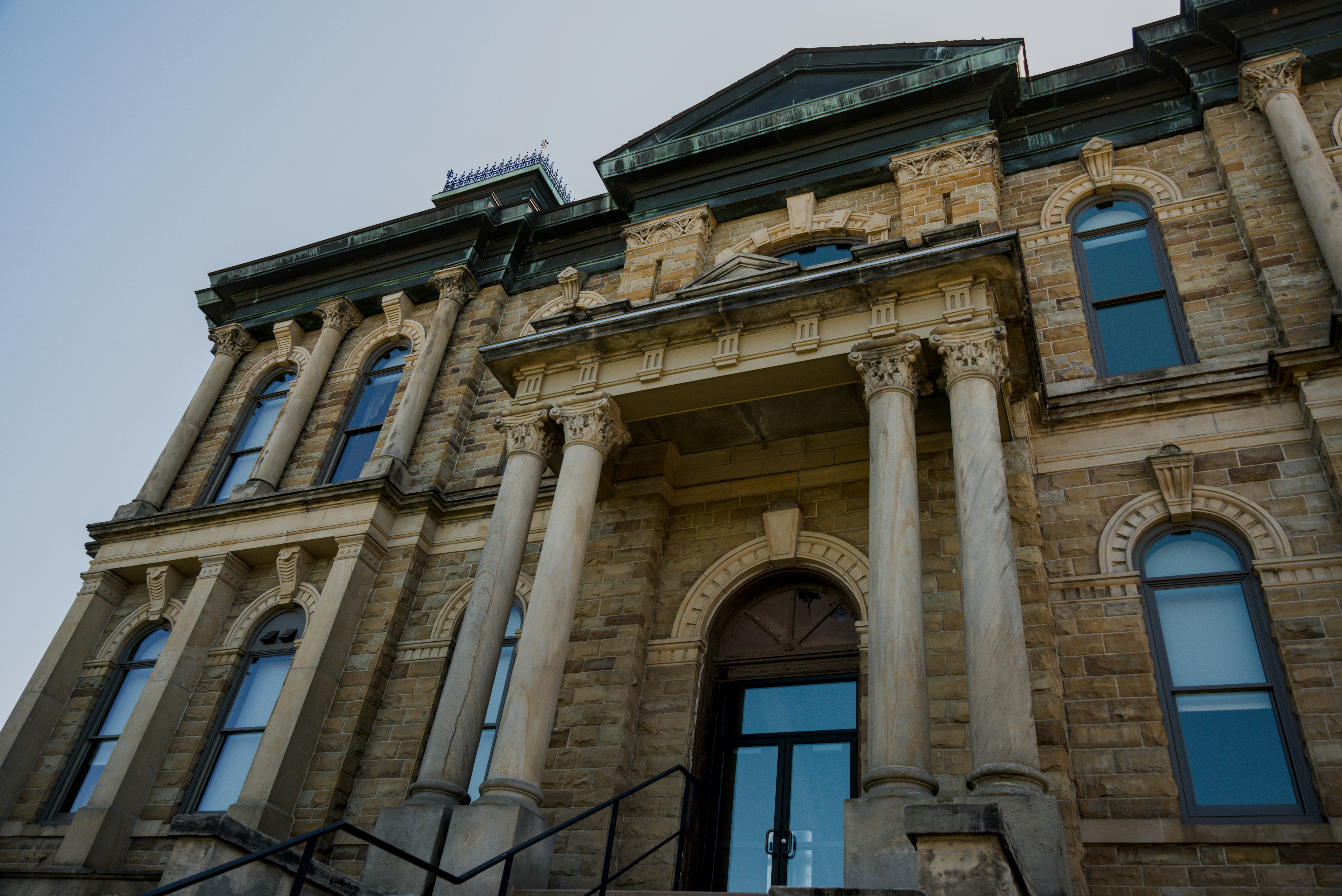 Stone Facade of a Classical Portal Rising Above Ornate Columns
