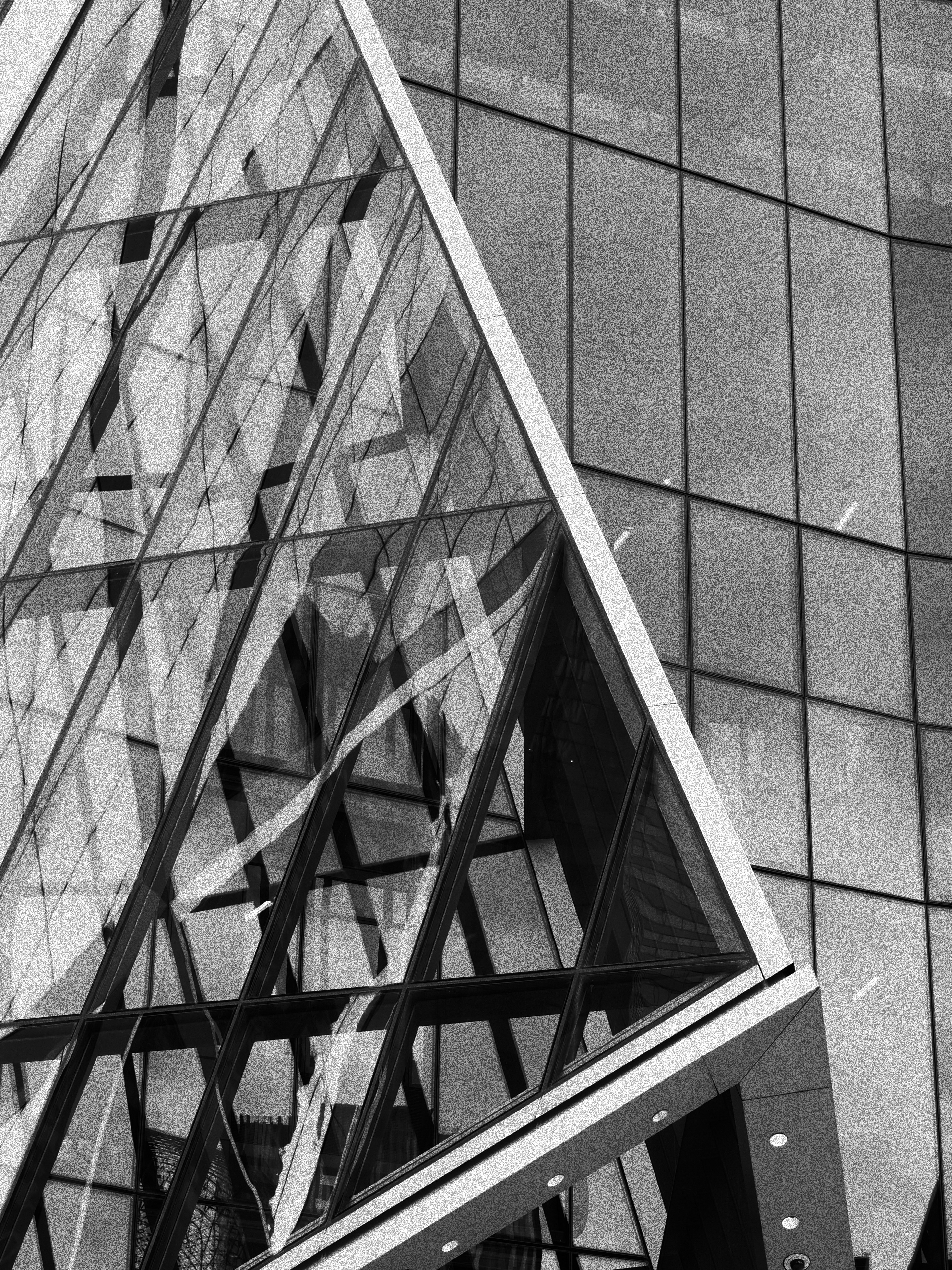 Architectural Facets: Diagonal Glass and Steel in Monochrome