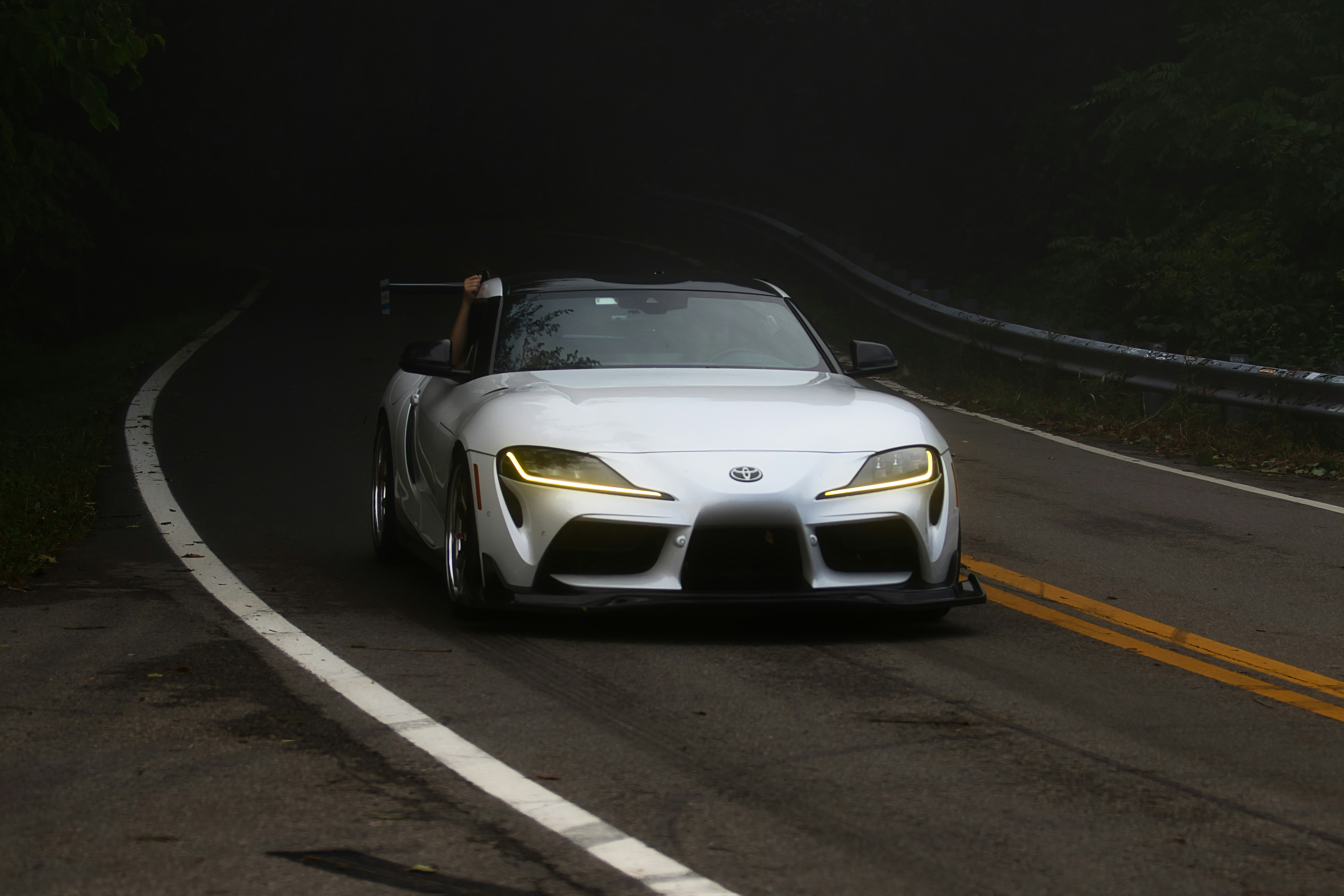 White thunder: a tuned coupe conquers a winding mountain road