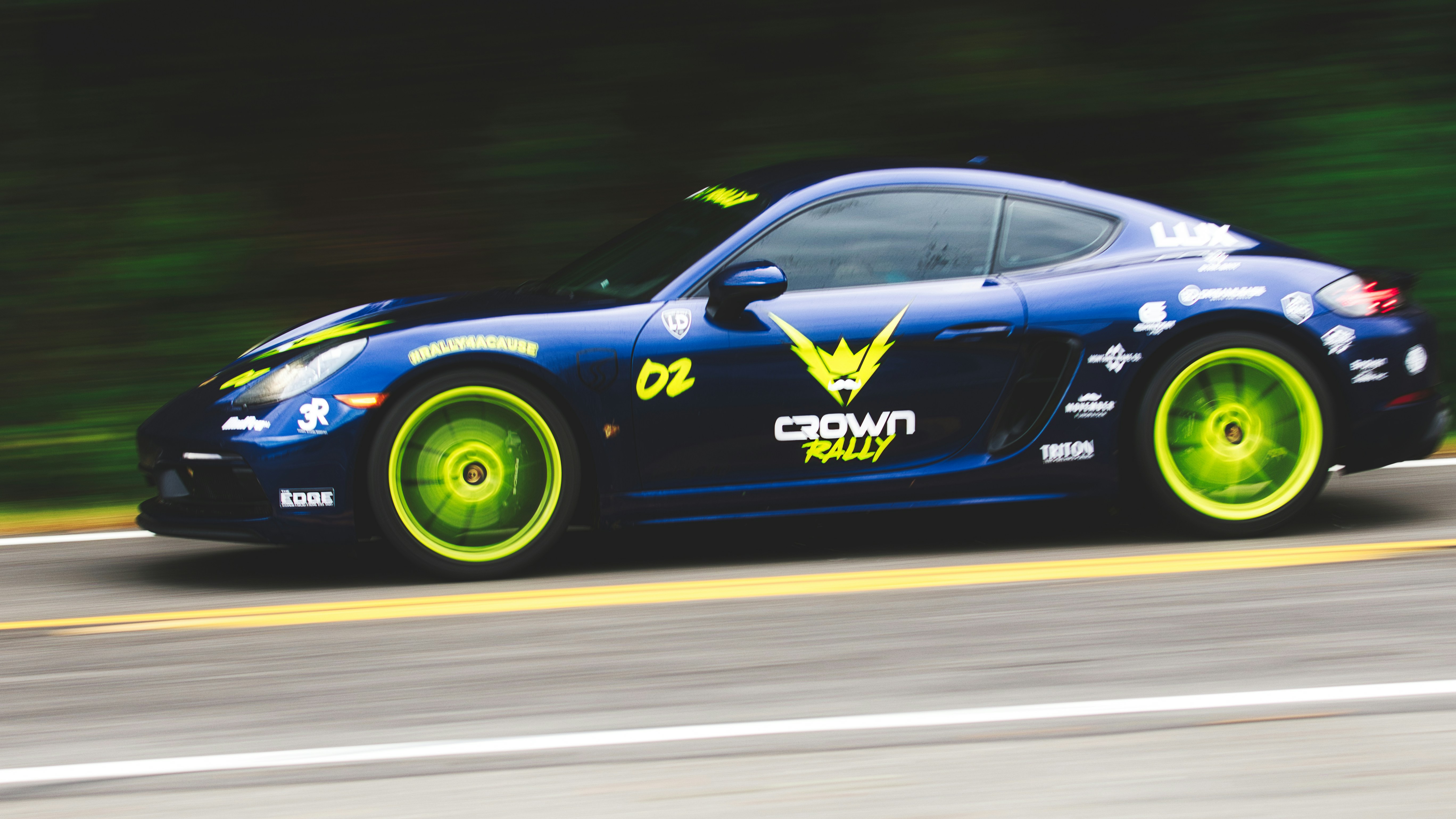 Blue Flame: Neon-Rimned Racecar in a Blur of Speed