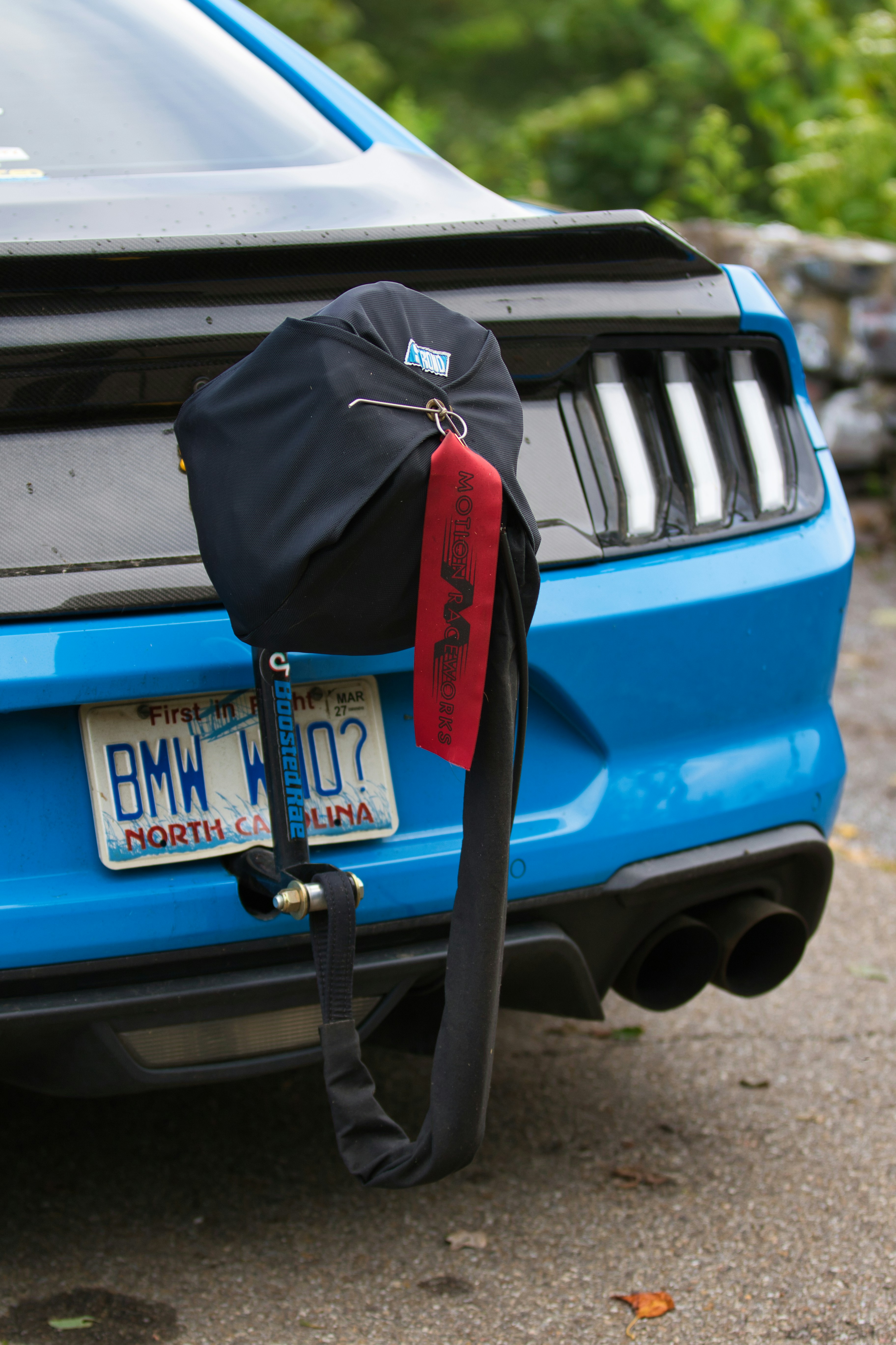 Blue Mustang Couture: A Car-tailored Cover Flutters Over the License Plate