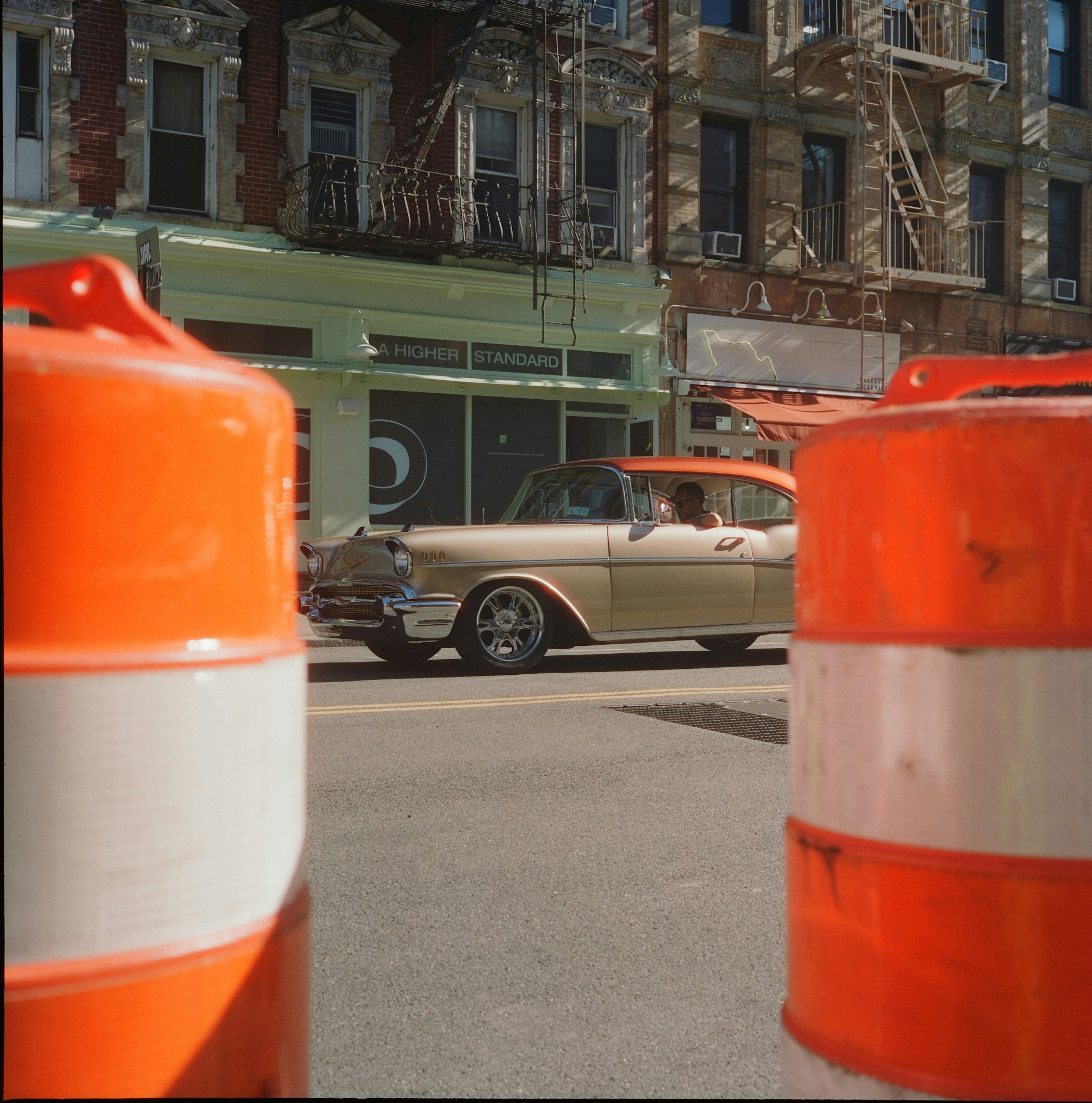 Street Thunder: Classic Car Framed by Urban Barriers