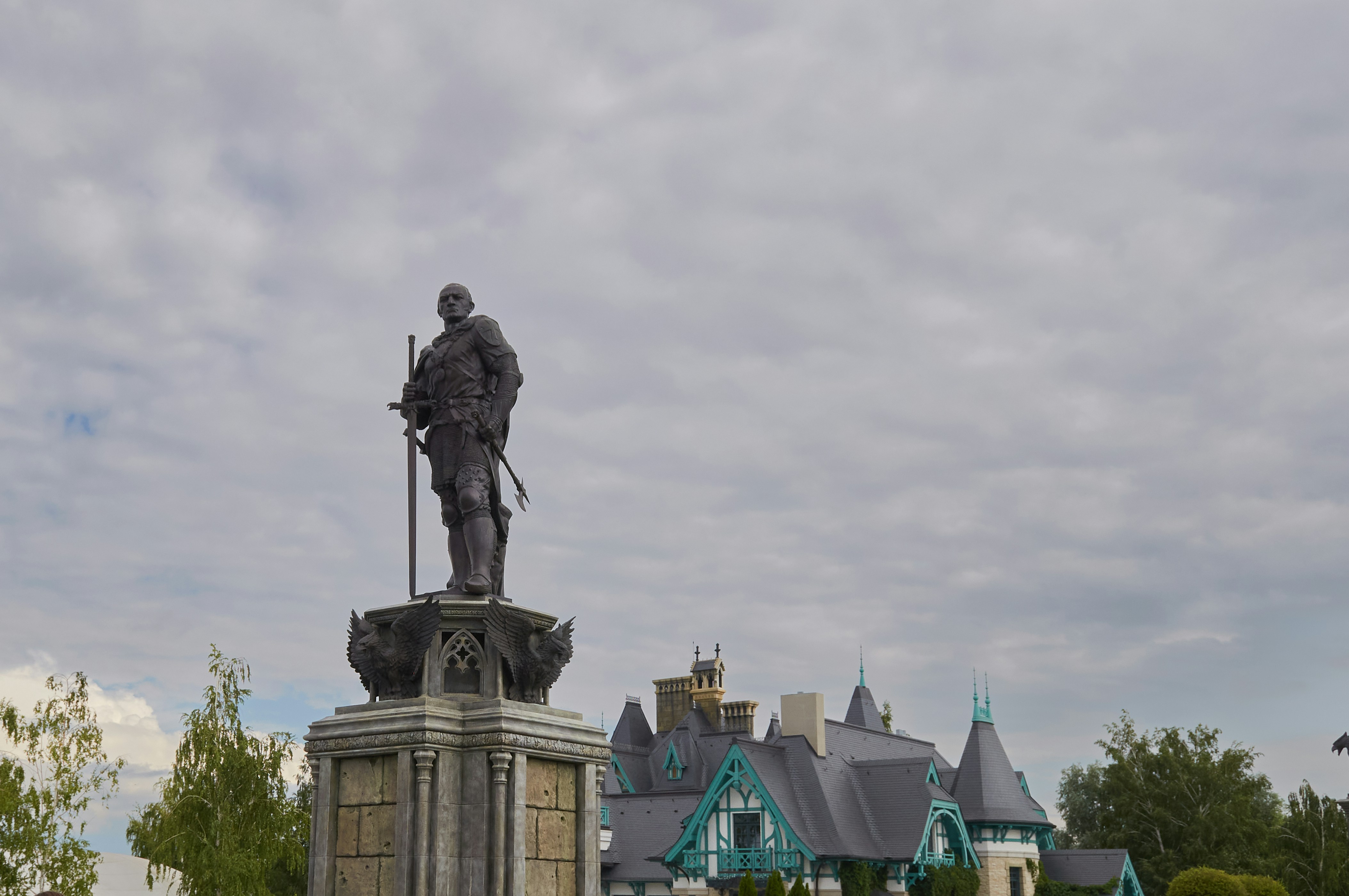Statue Sentinel Overlooking a Fairytale Roofscape