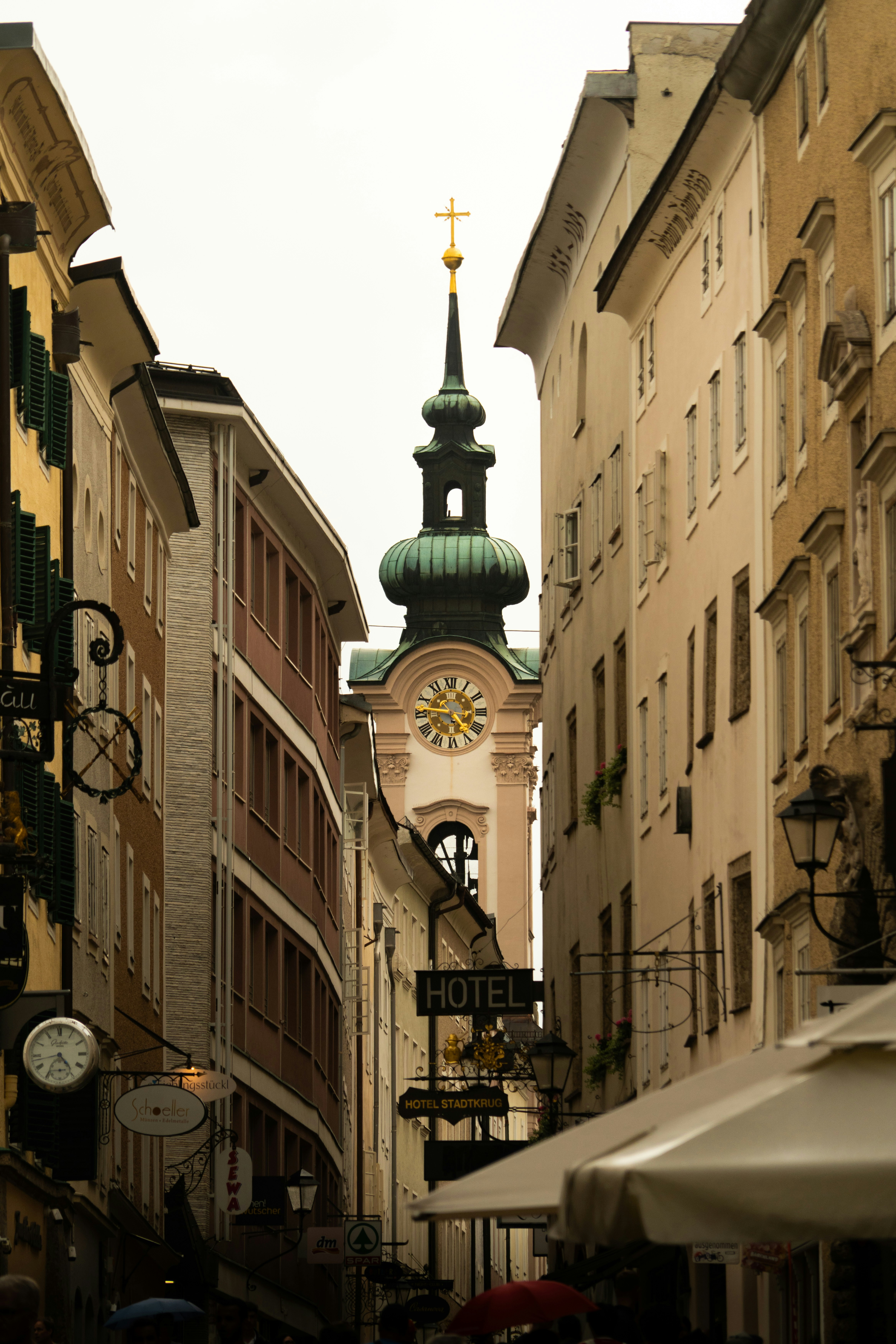 Clock Tower Amid Narrow European Calle