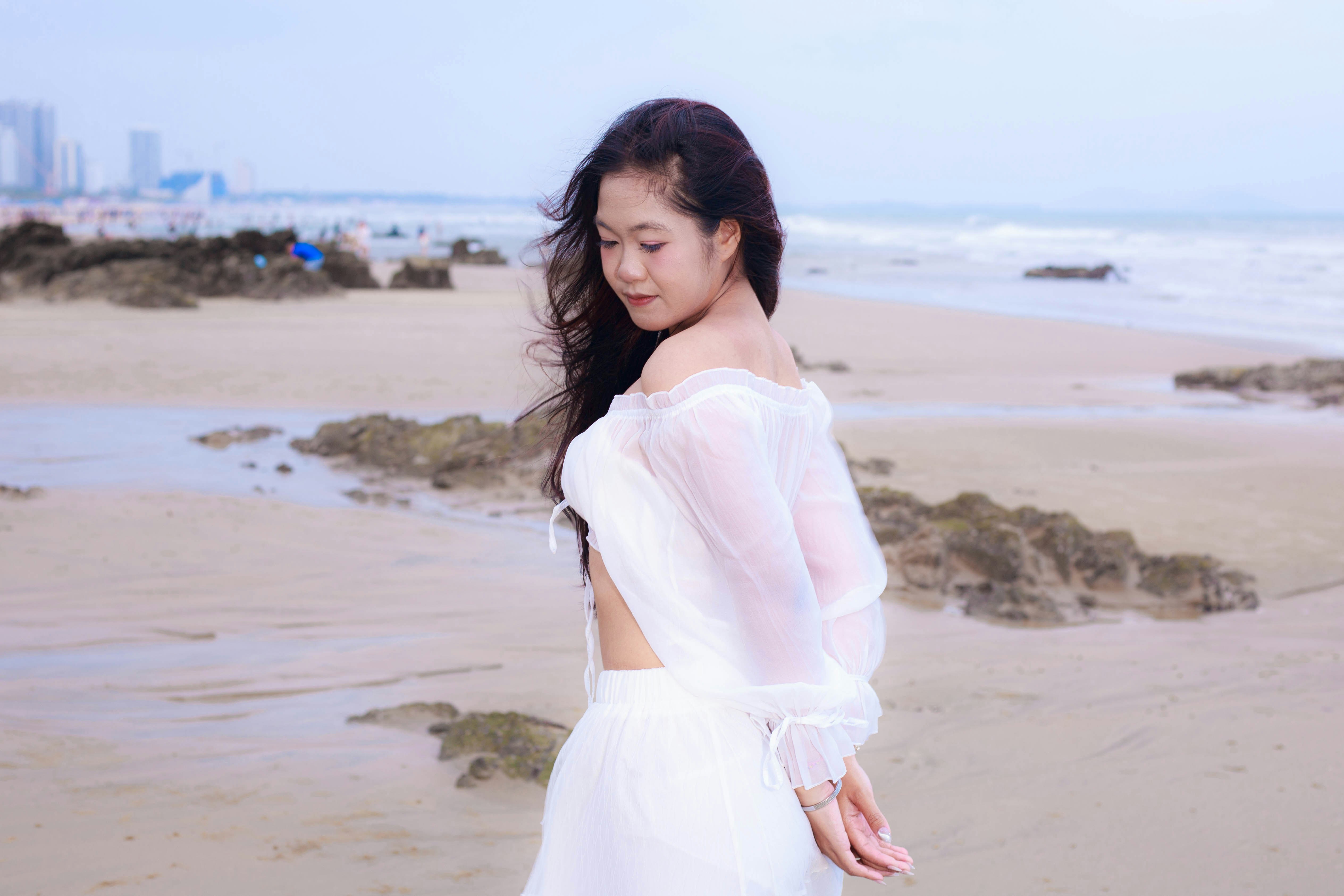 Whispers of the Sea: A Silent Moment in White on the Shore