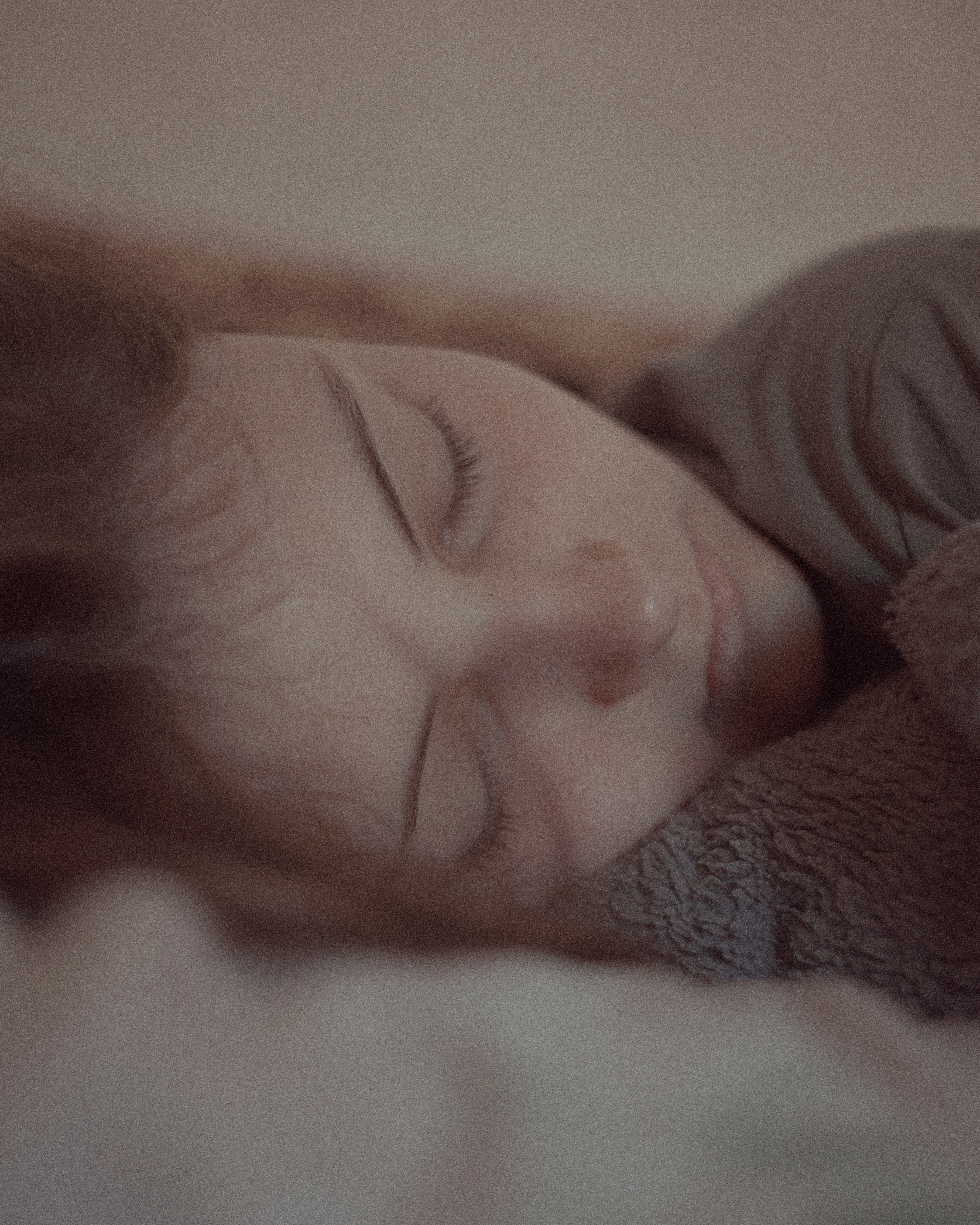 Soft Slumber: A Quiet Face Resting in Gentle Light