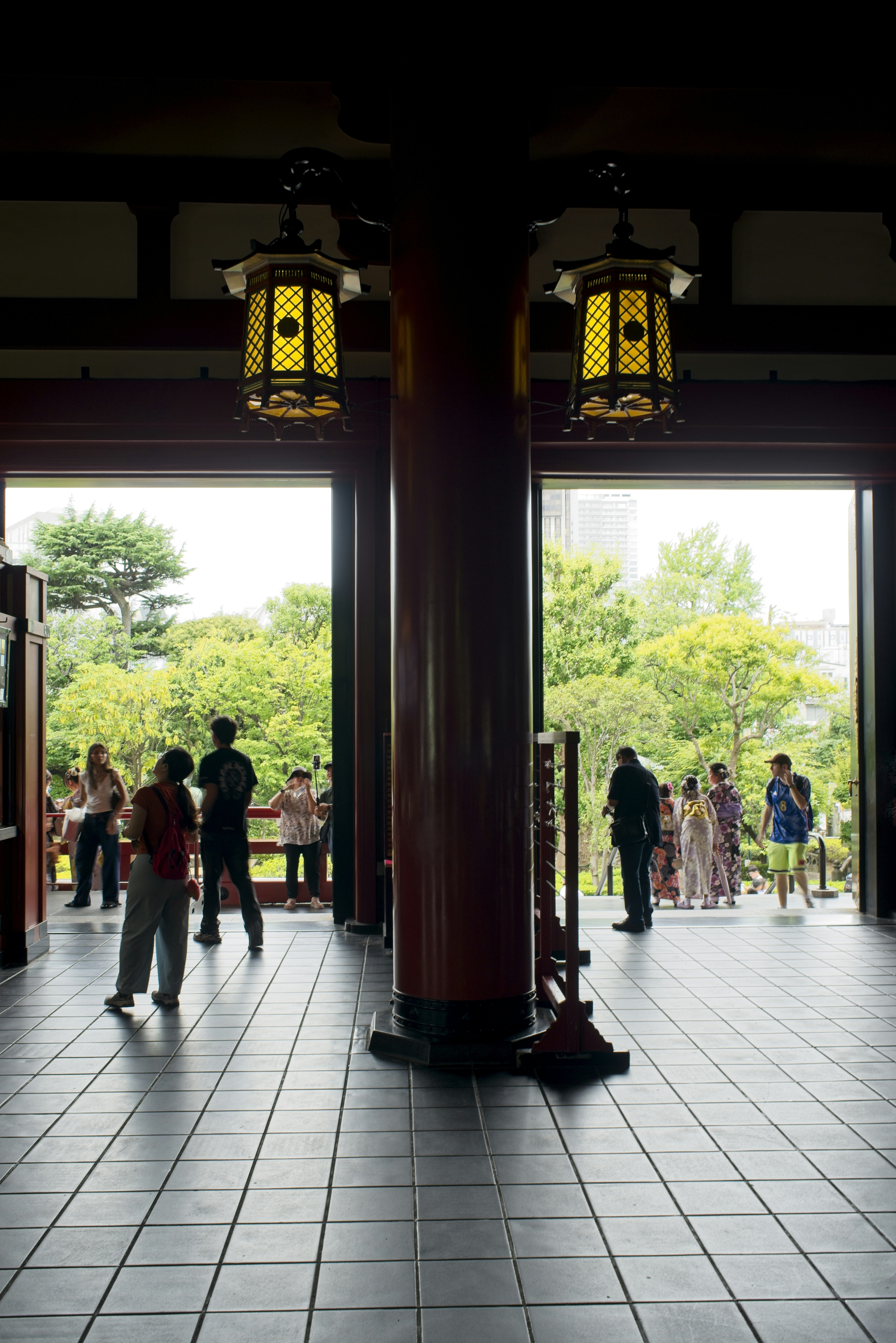 Lanterns Over a Threshold: People at the Temple Entrance