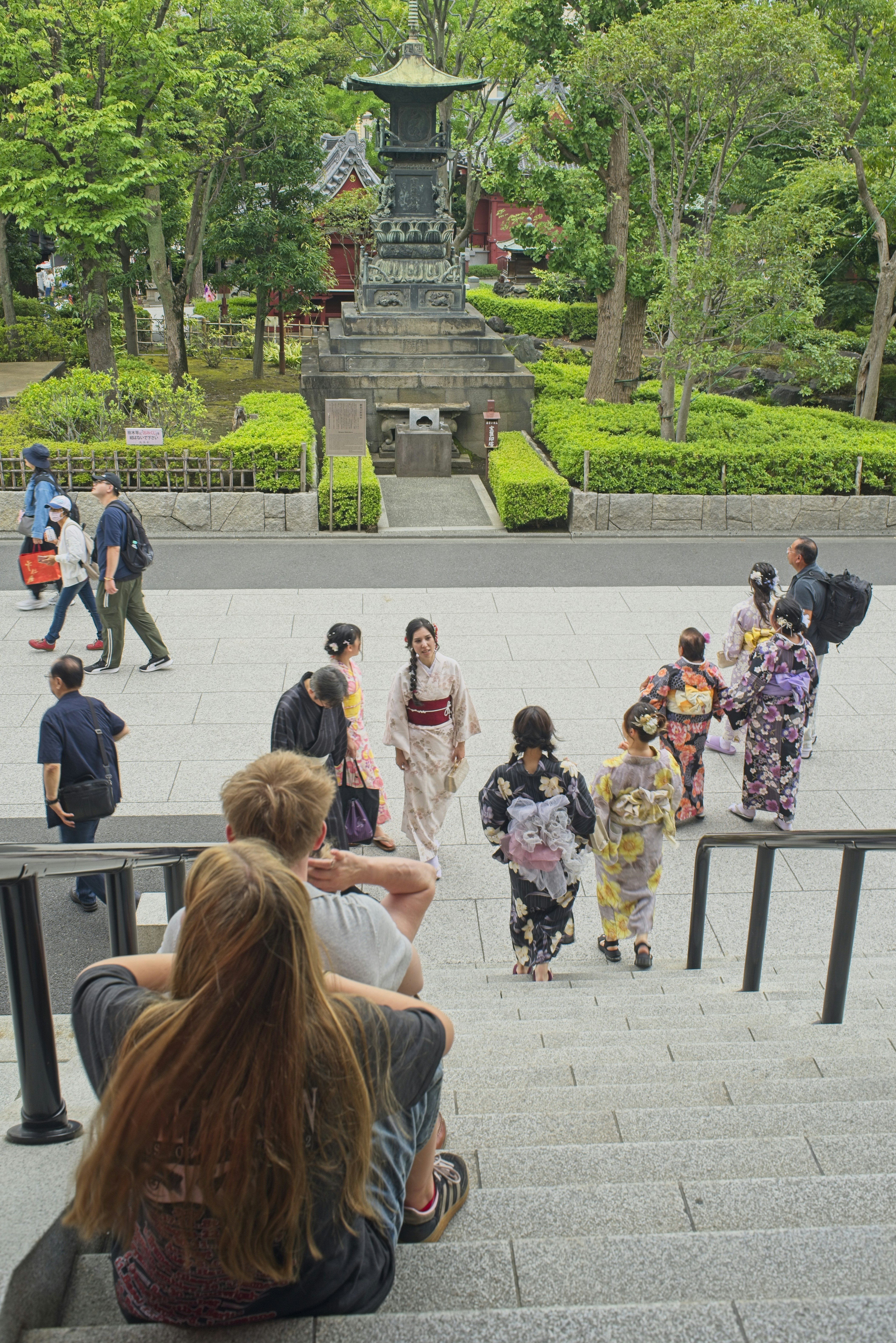 Staircase to Tradition: Tourists in Evening Kimono at a Temple Courtyard