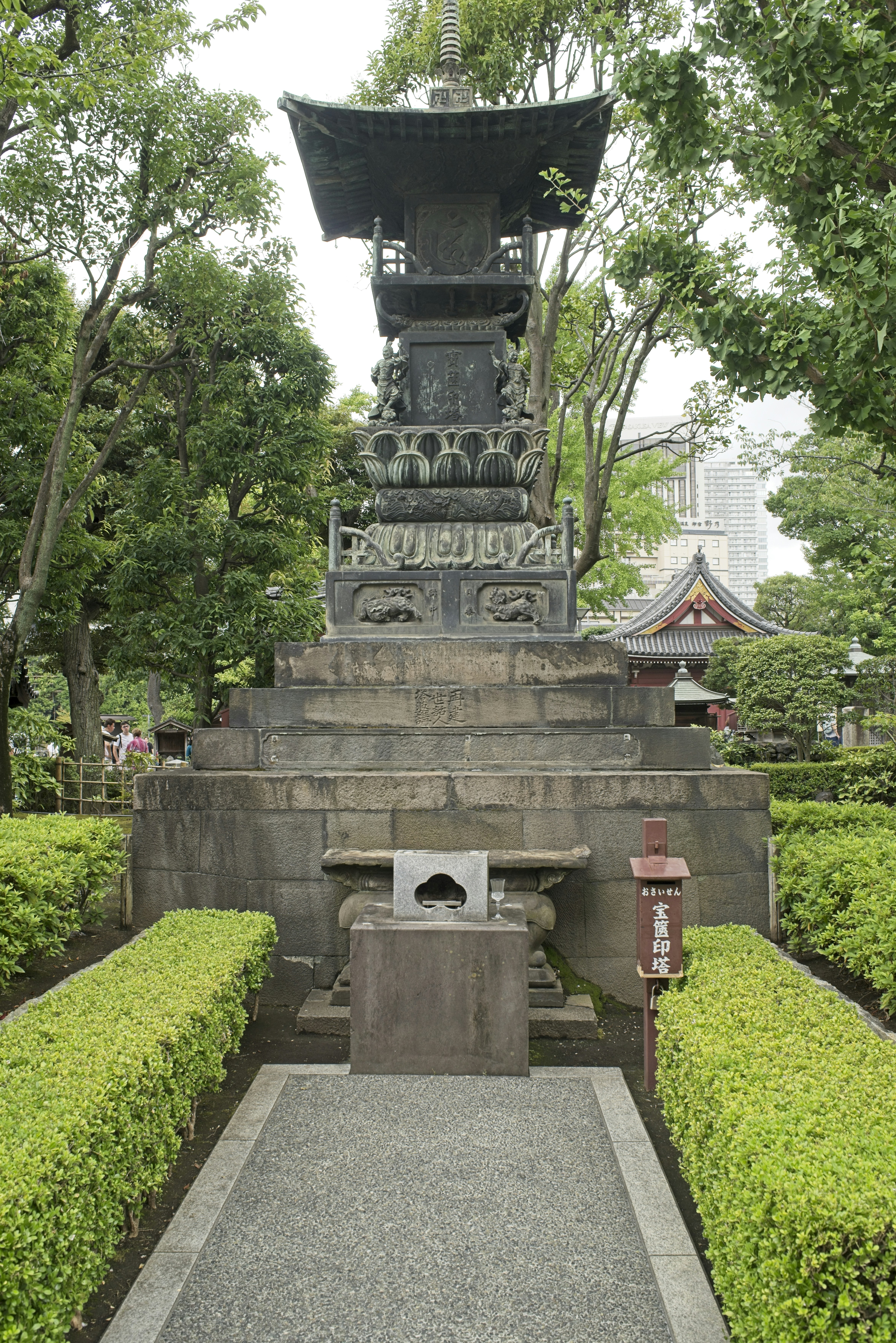 Stone Lantern Tower Rising Above Immersed Gardens