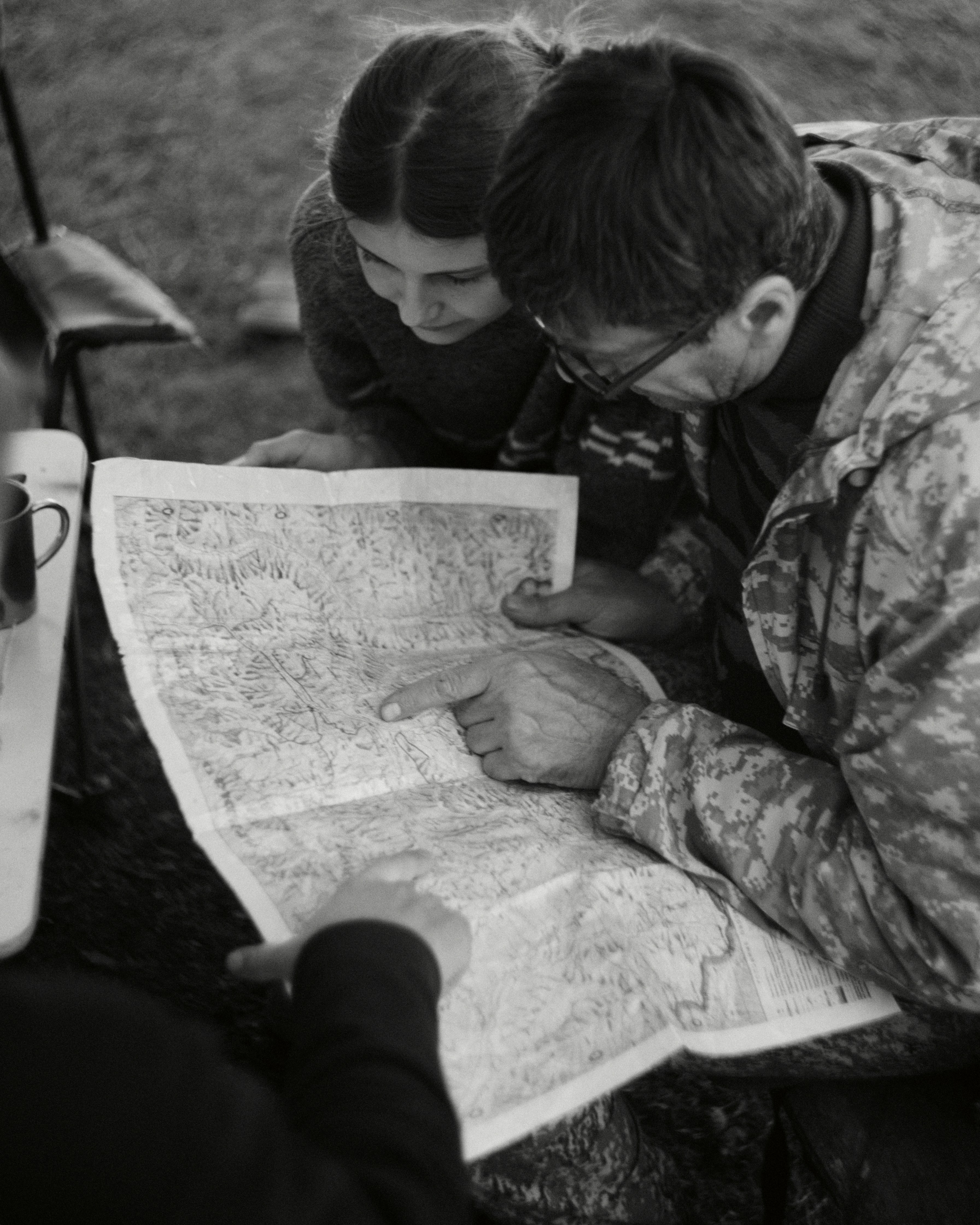 Field Map Consultation: Soldiers and Companion Studying a Topographic Chart