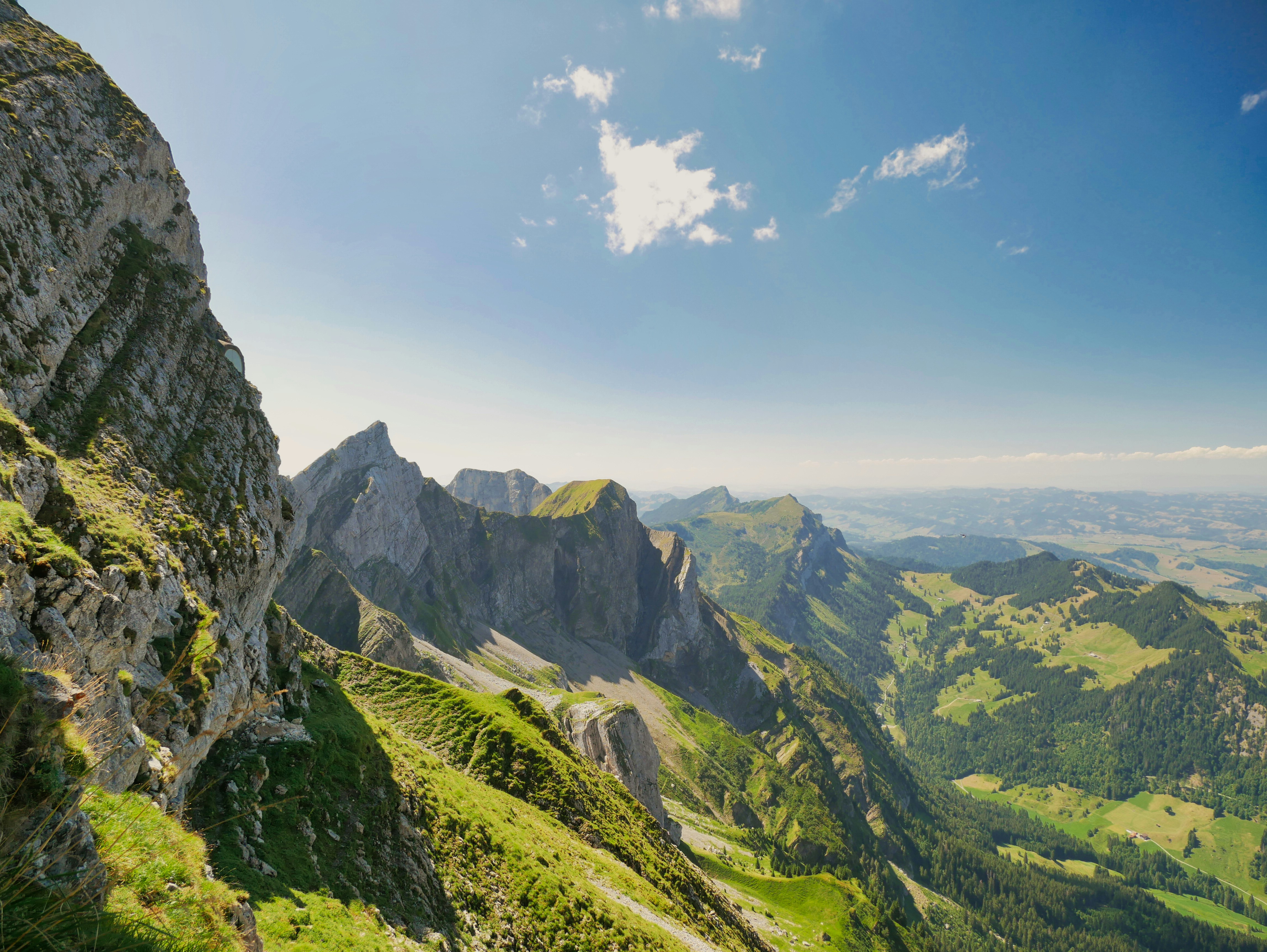 Wind-Swept Ridge Perspective over Alpine Valleys