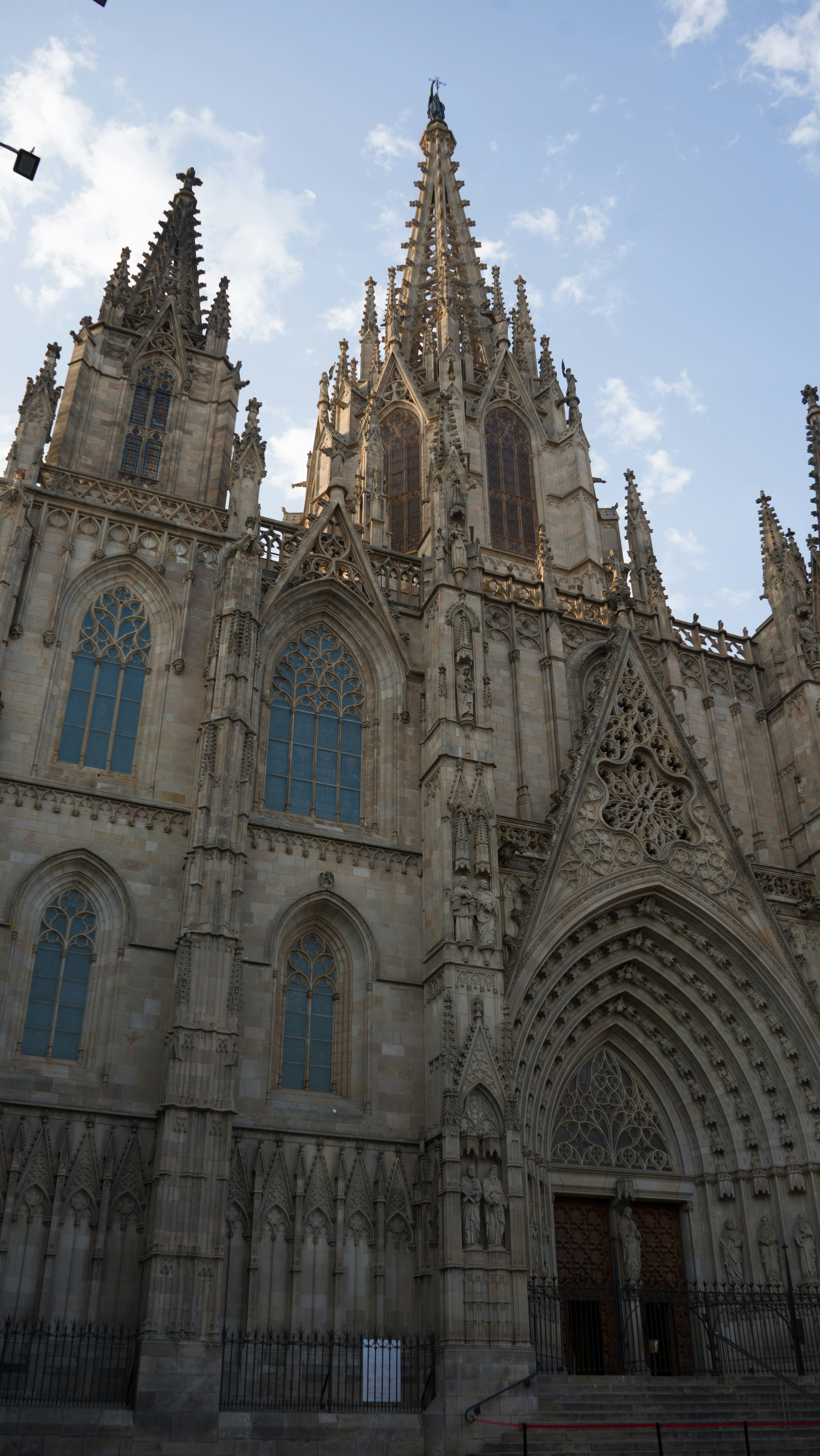 Gothic Facade in Stone: Towers Reaching Toward a Clear Sky