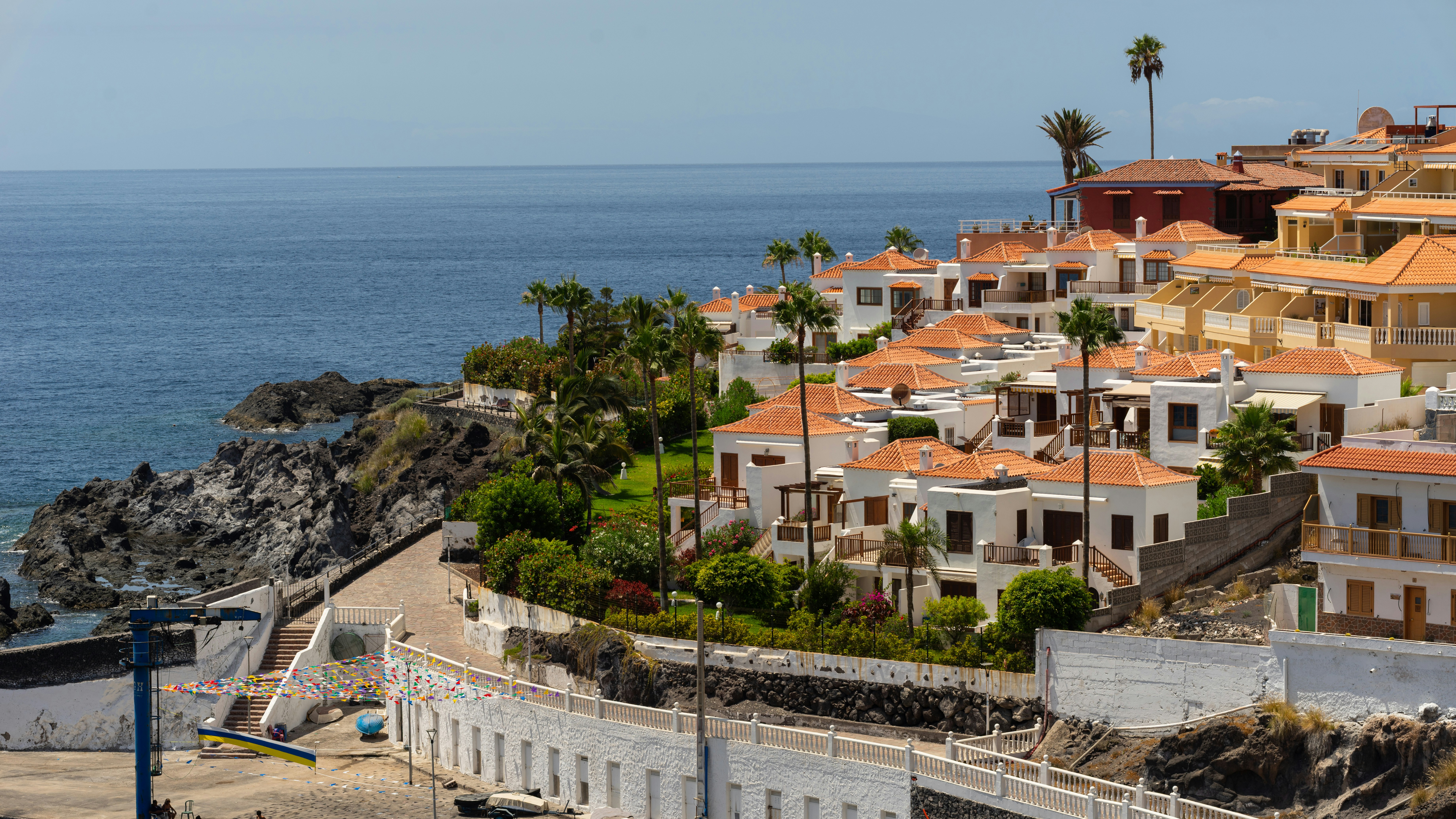 Terraced Costa: Sunlit Village Clinging to the Cliff