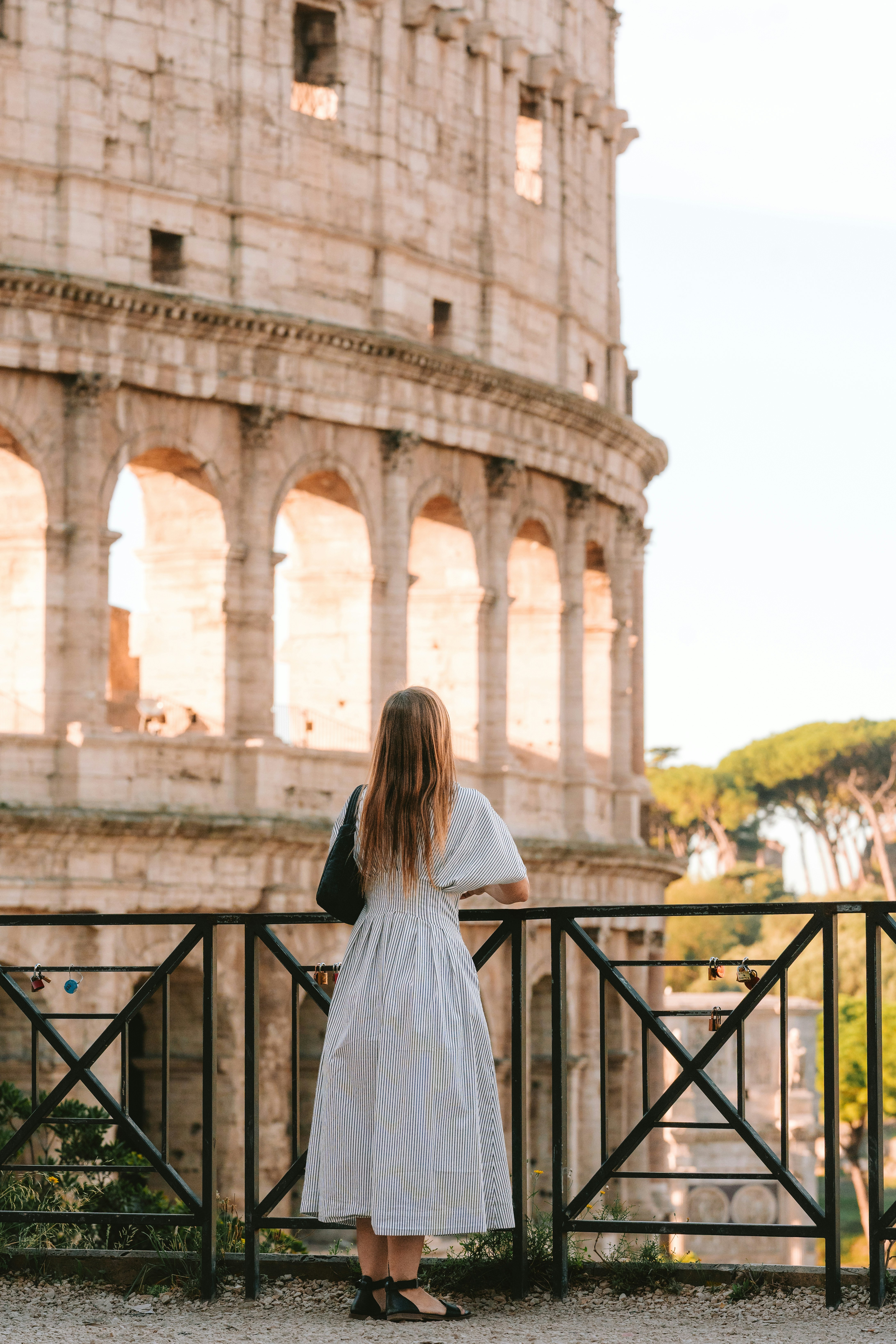 Tourist at the Colosseum Gate: A Portrait by the Ancient Wall