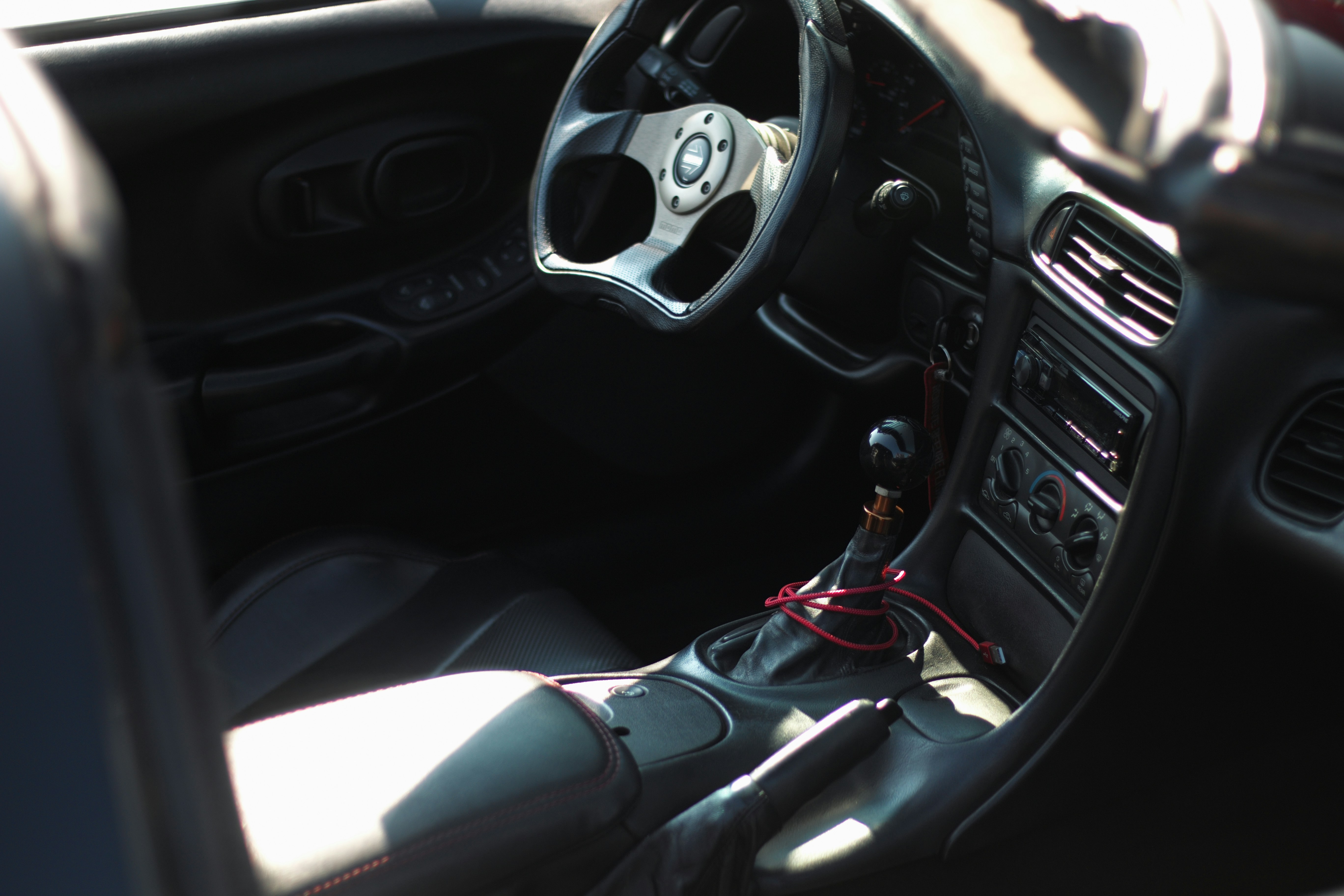 Cockpit Stillness: A Dim, Curved Interior with Focused Steering Wheel