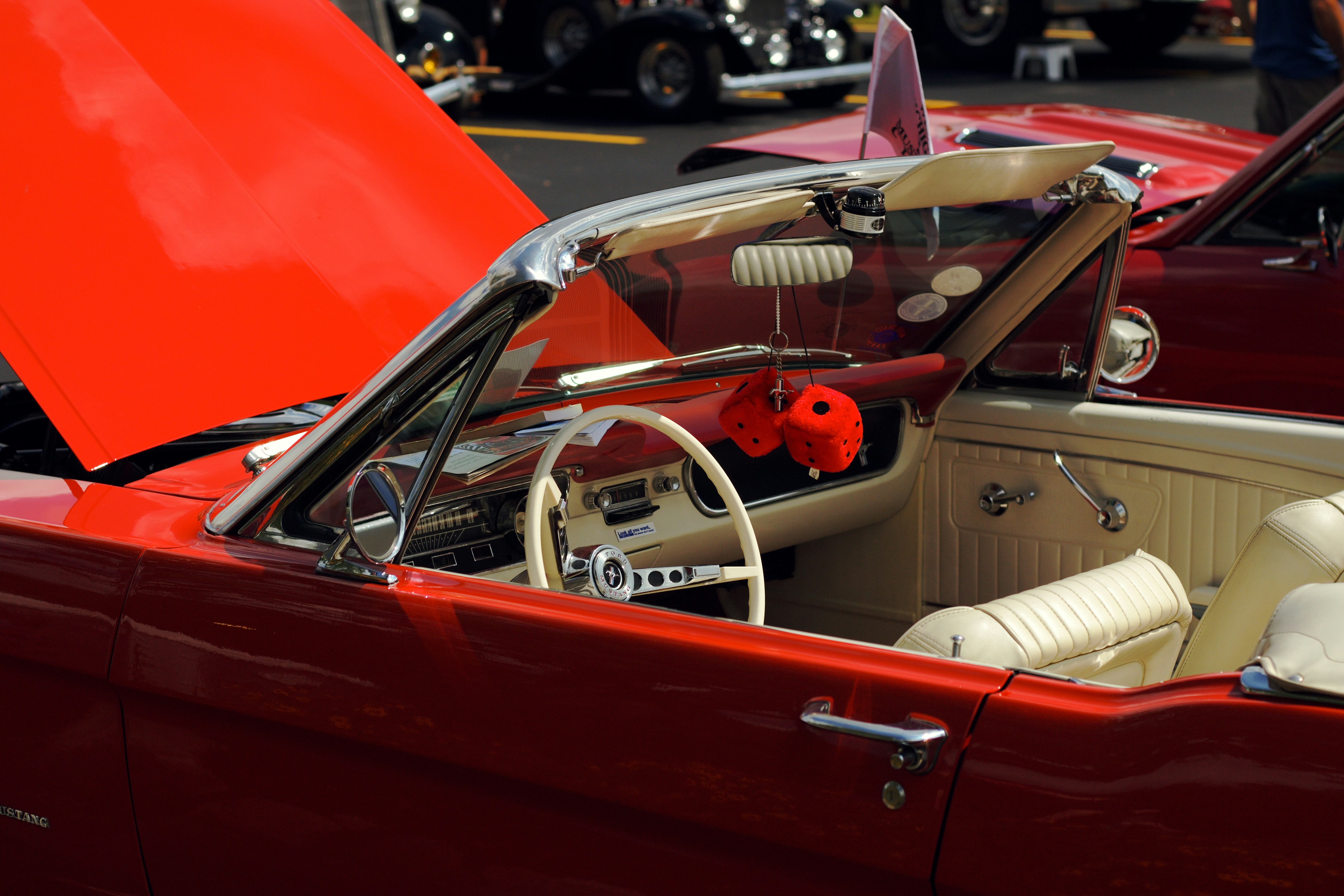 Crimson Convertible Dream: Classic Car Interior Under Soft Showroom Light