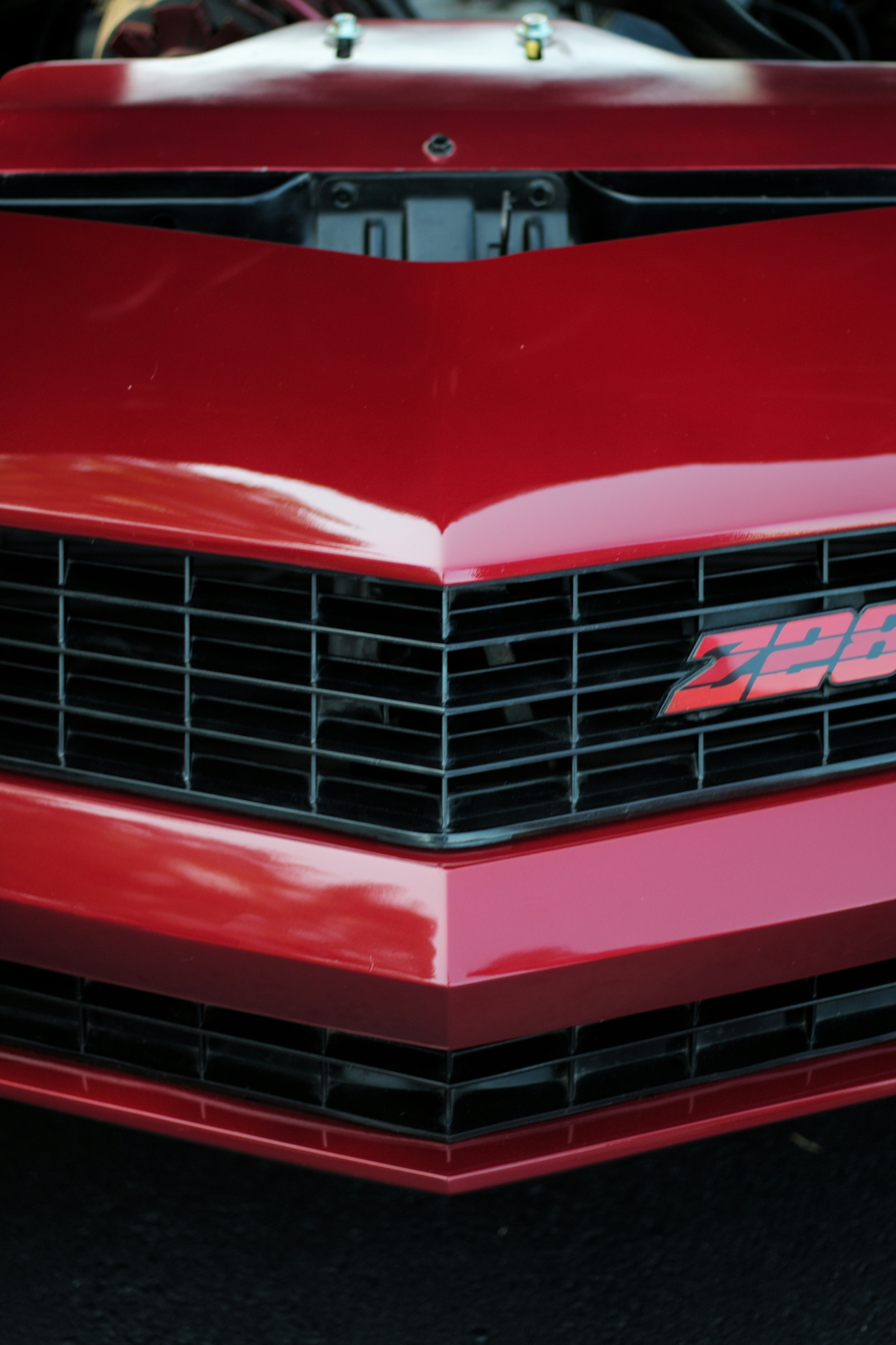 Front-and-Centre Gorge: The Red Cheeks of a Classic Car Grille