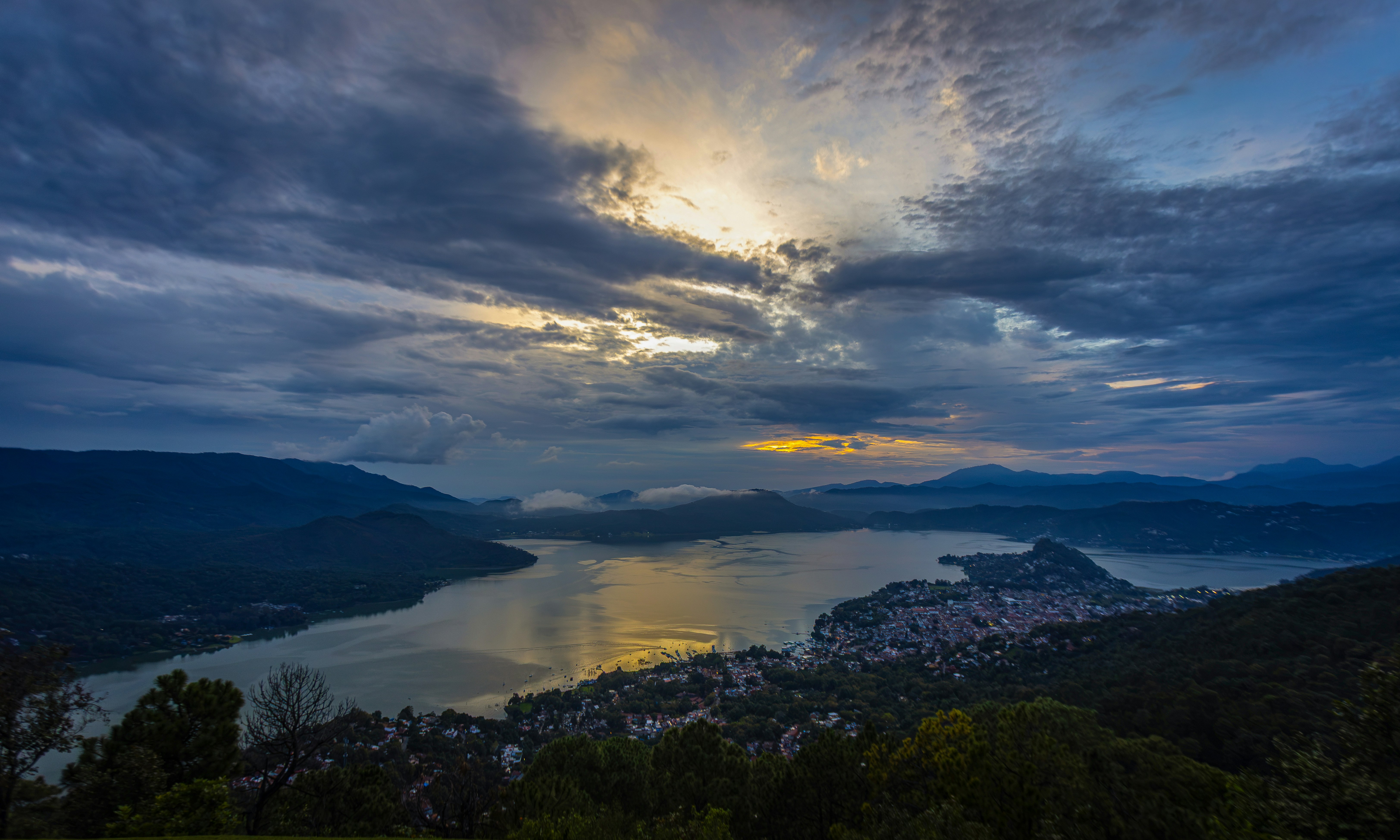 Evening Aureole over a Serene Lake Valley