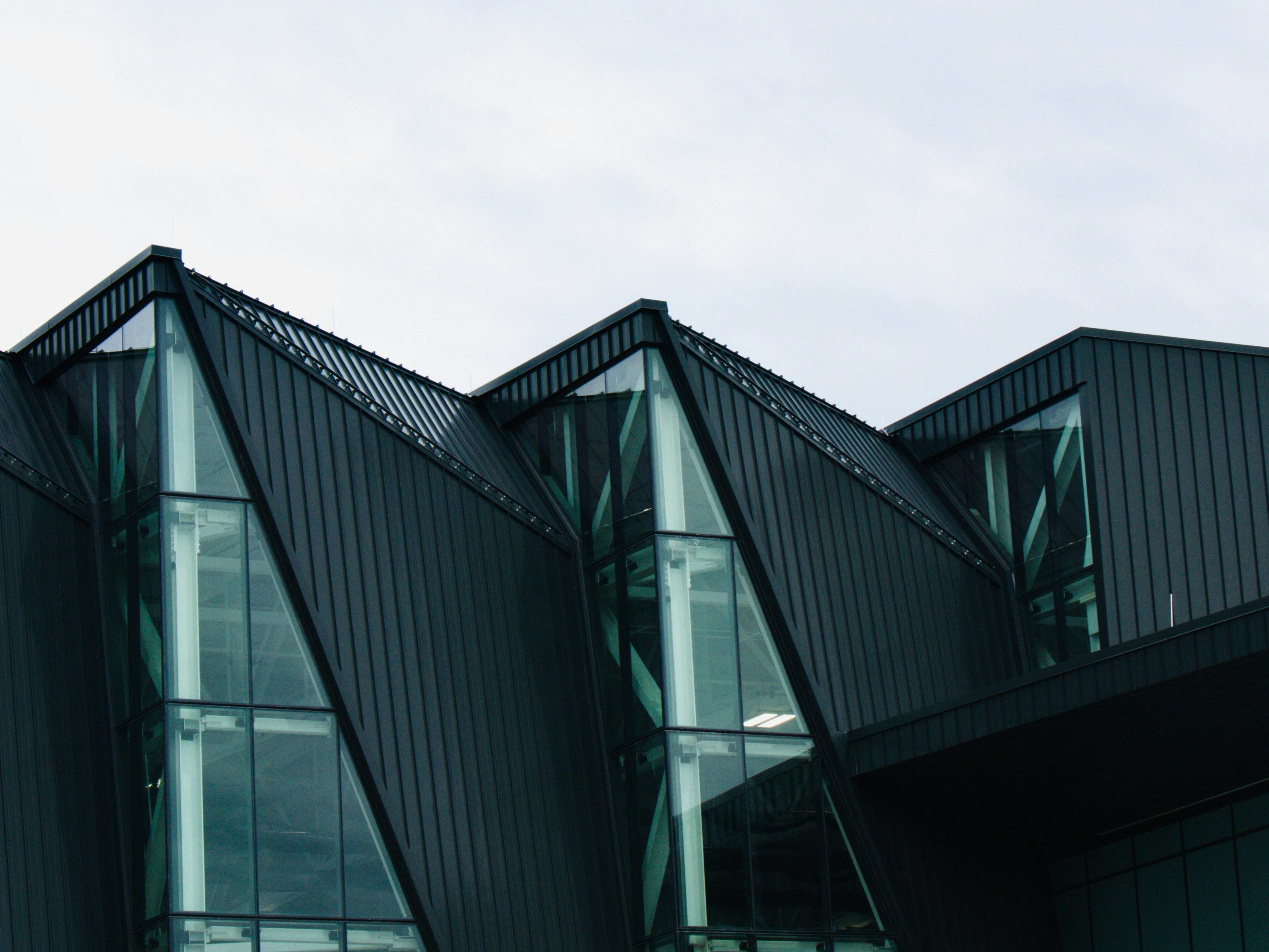 Geometric Peaks: Angular Facades under Soft Sky