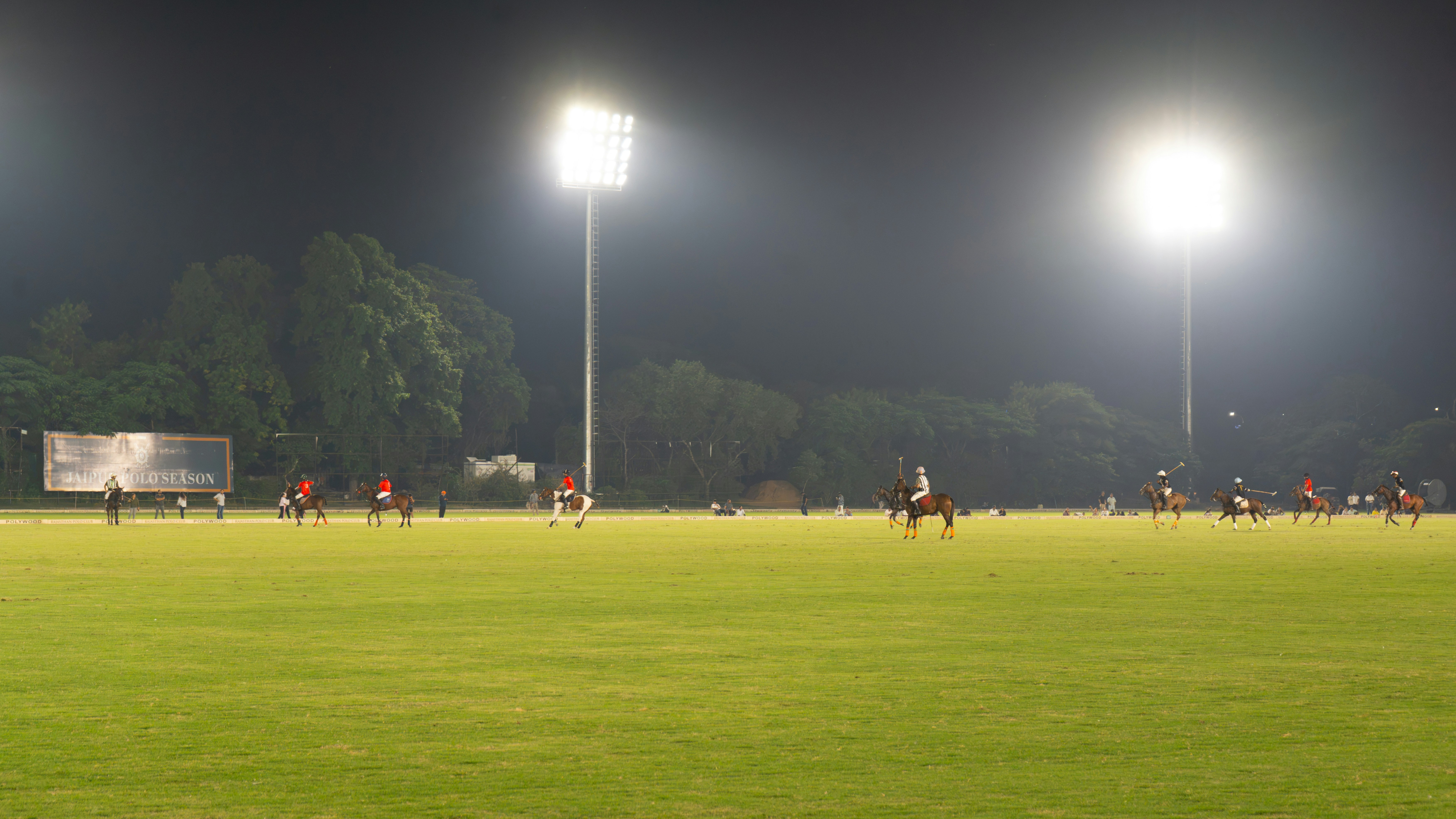 Nighttime Field Under Floodlights: Long-Range Action on the Grass