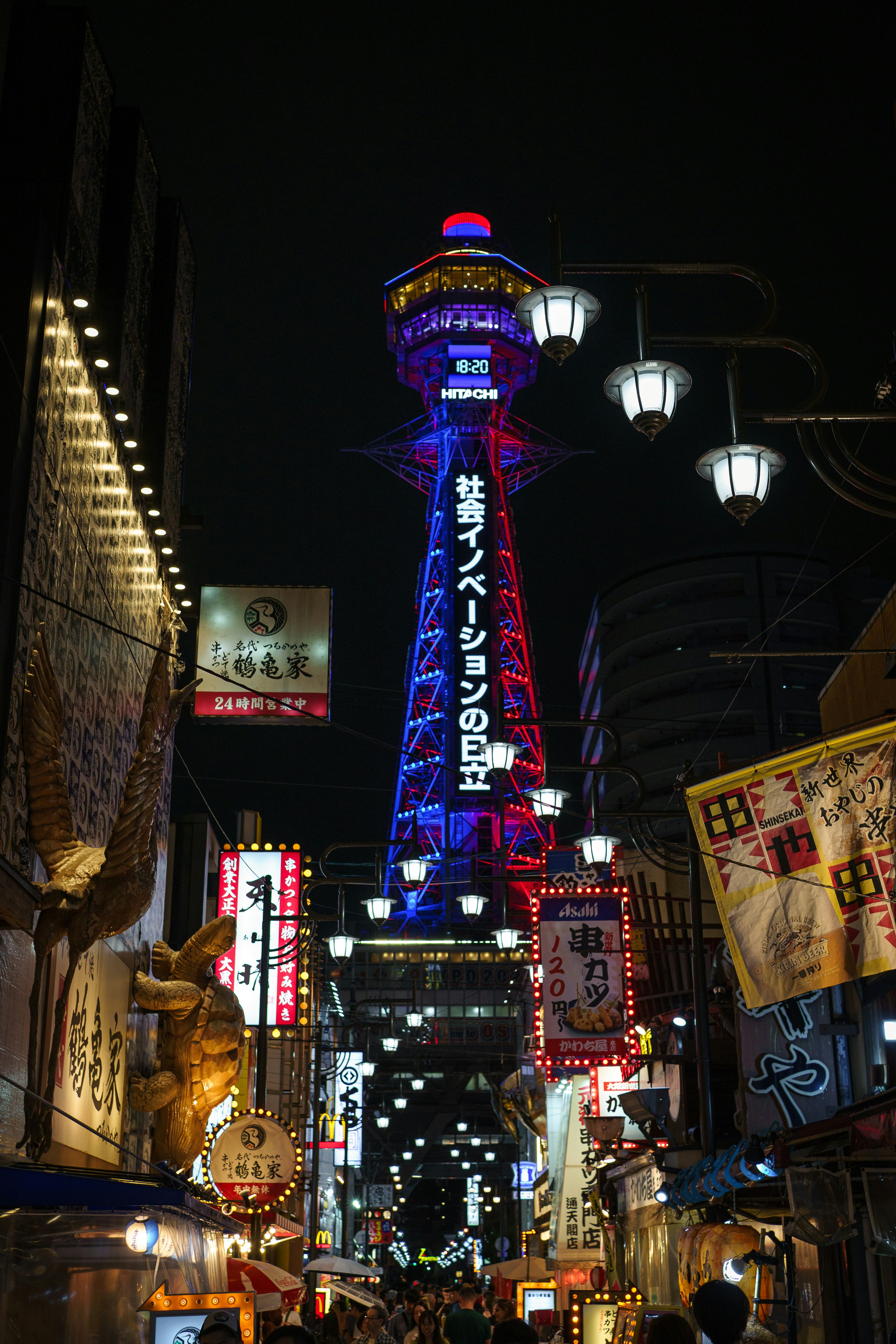 Neon Lantern Alley Beneath the Tower at Night