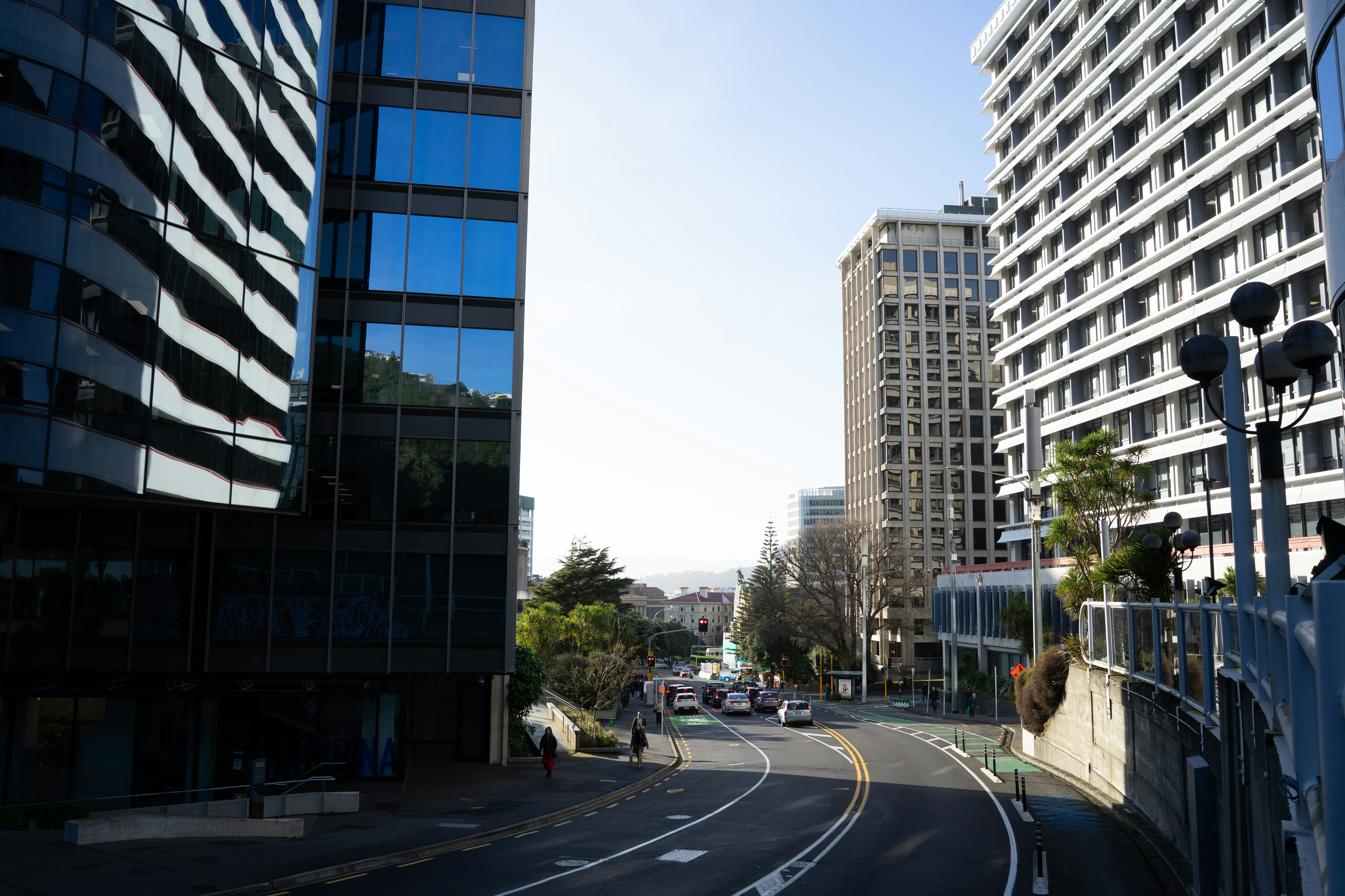 Urban Canyon: A Quiet Curved Street Between Glass Towers